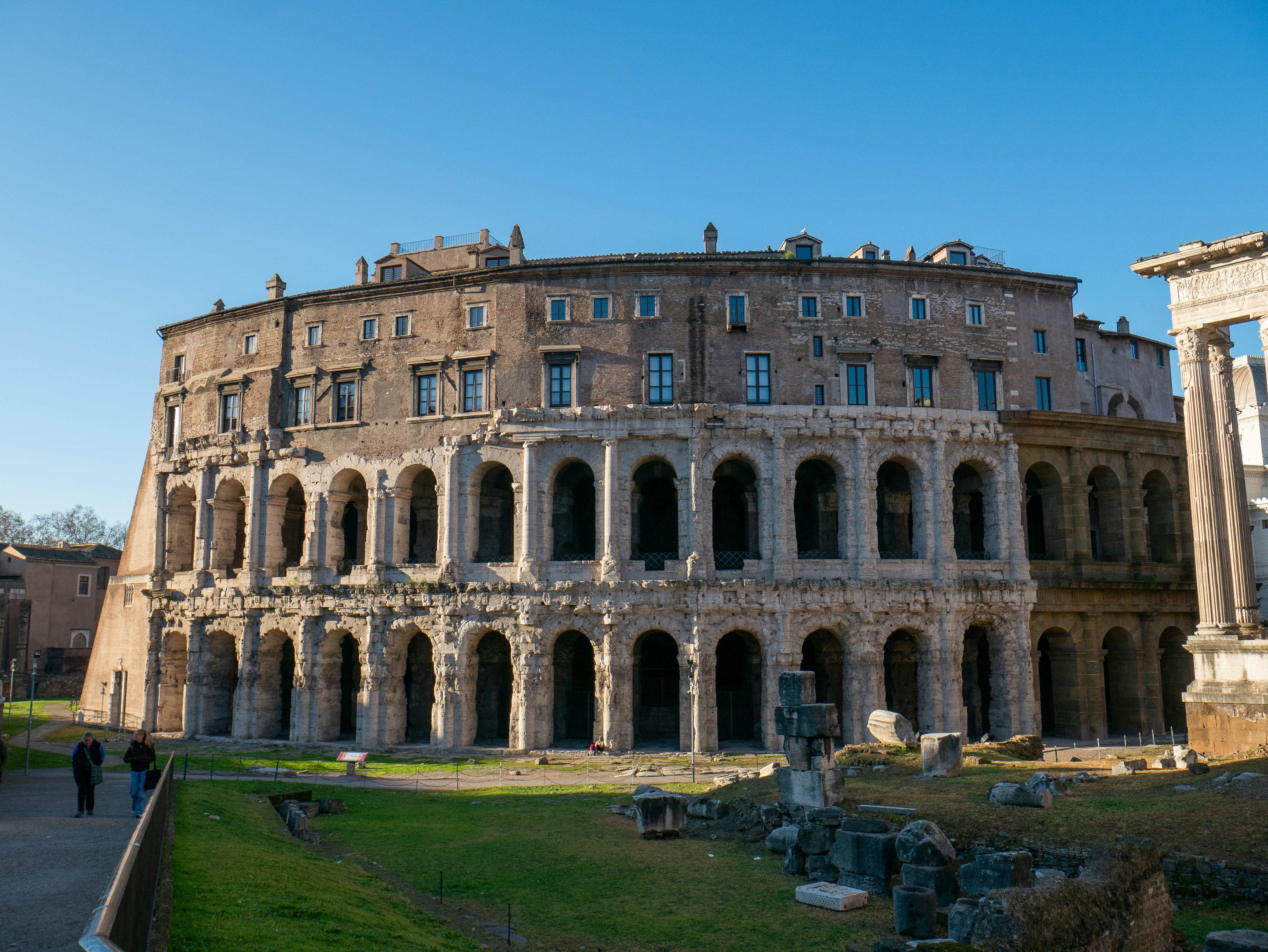 A large building that is in the middle of a field photo – Free Roman ...