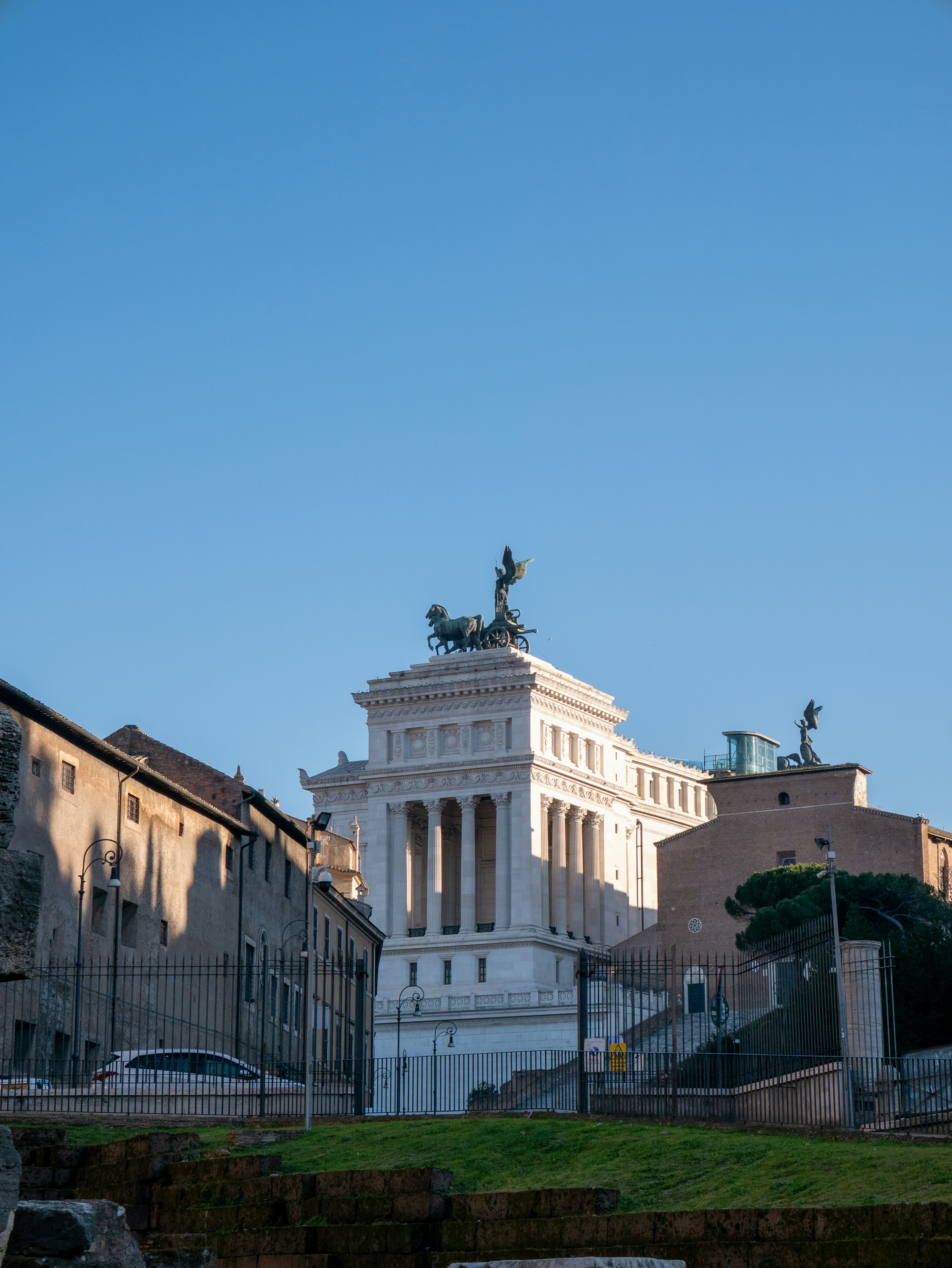 Marble Crown: Equestrian Monument Rising Over Rome’s Neoclassical Gate