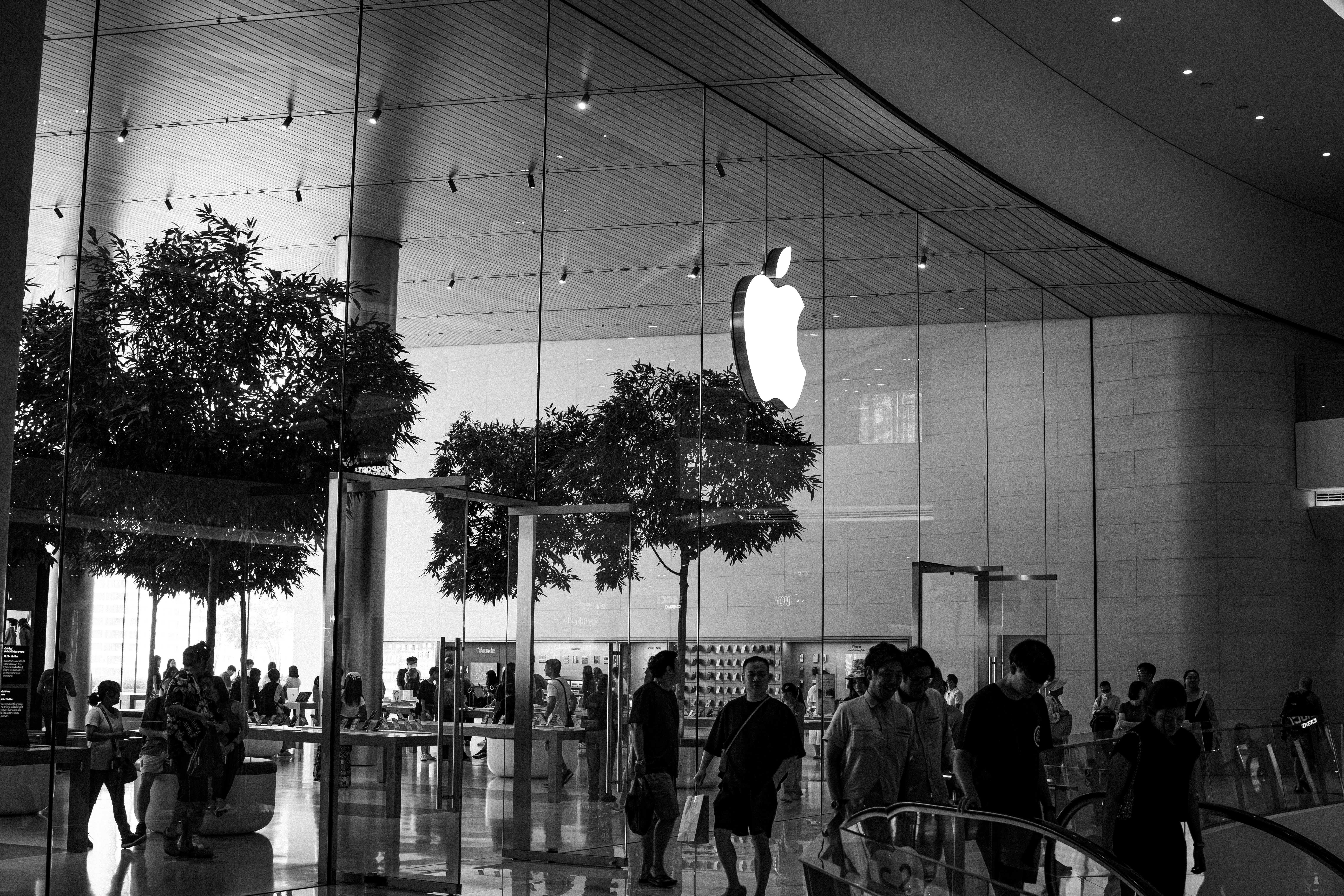A black and white photo of people in a lobby