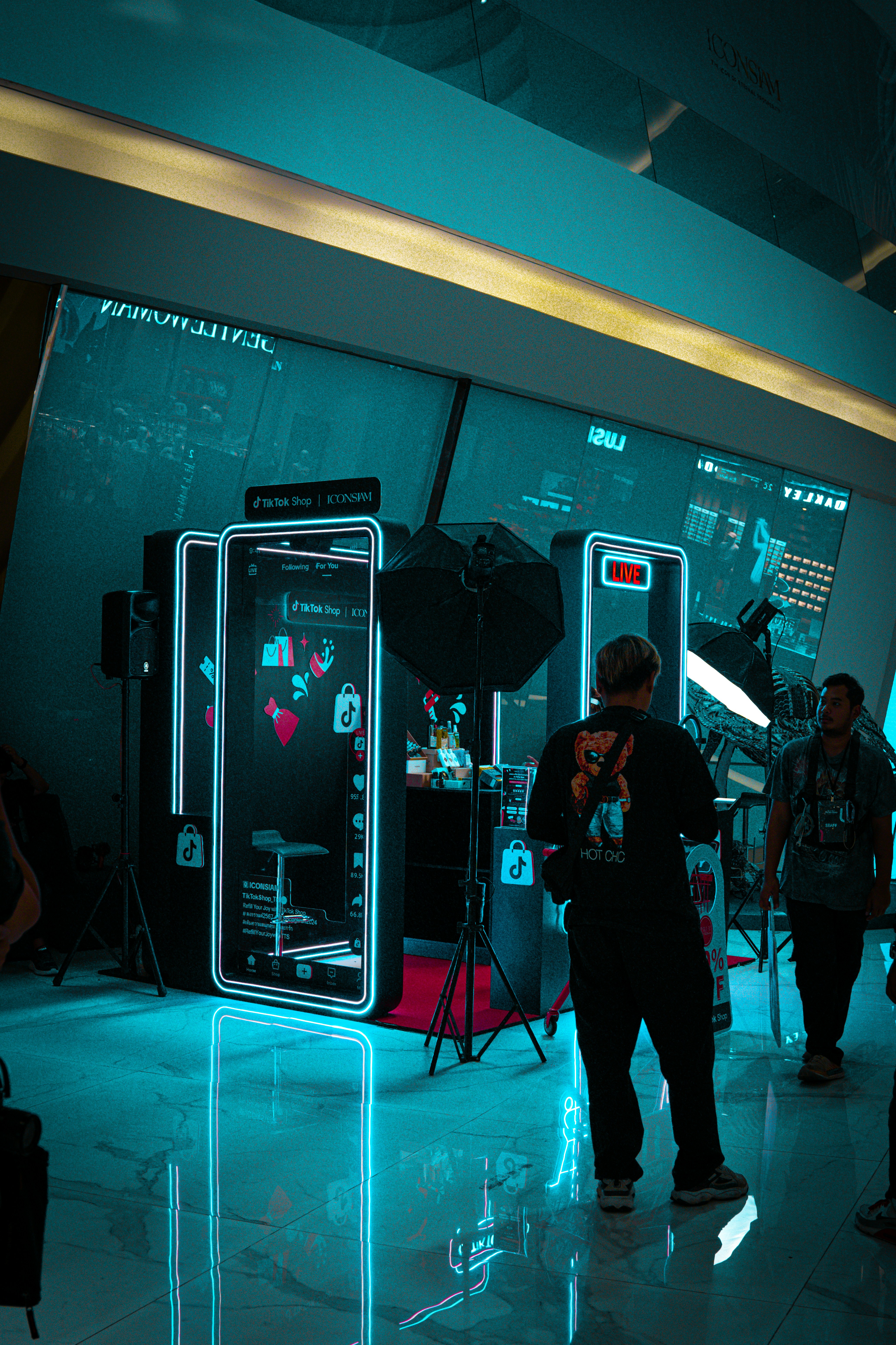 A group of people standing around a room photo – Free Tiktok Image on ...
