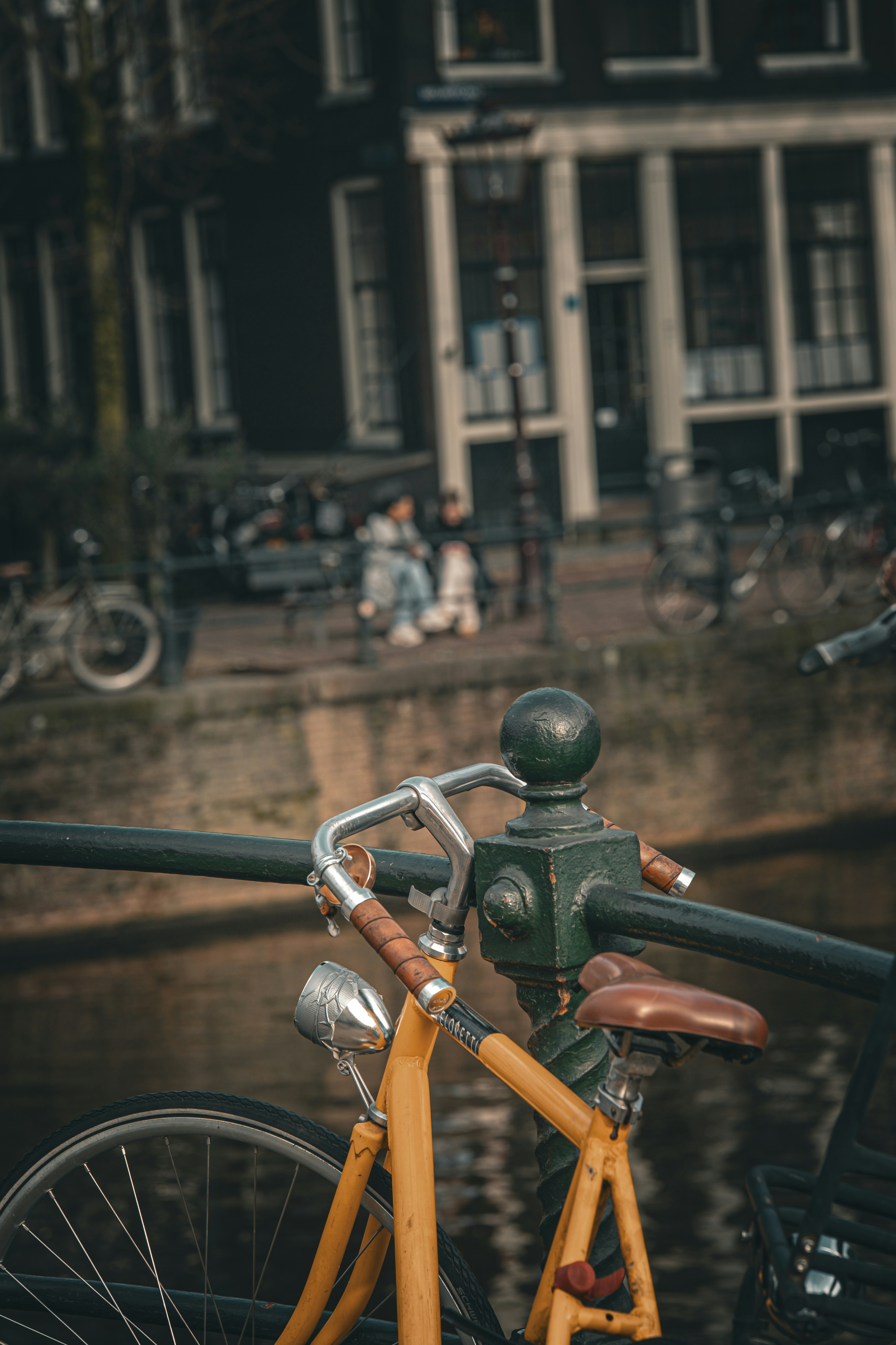 Amber Bicycle at the Canal: Locks, Rails, and Quiet Urban Geometry