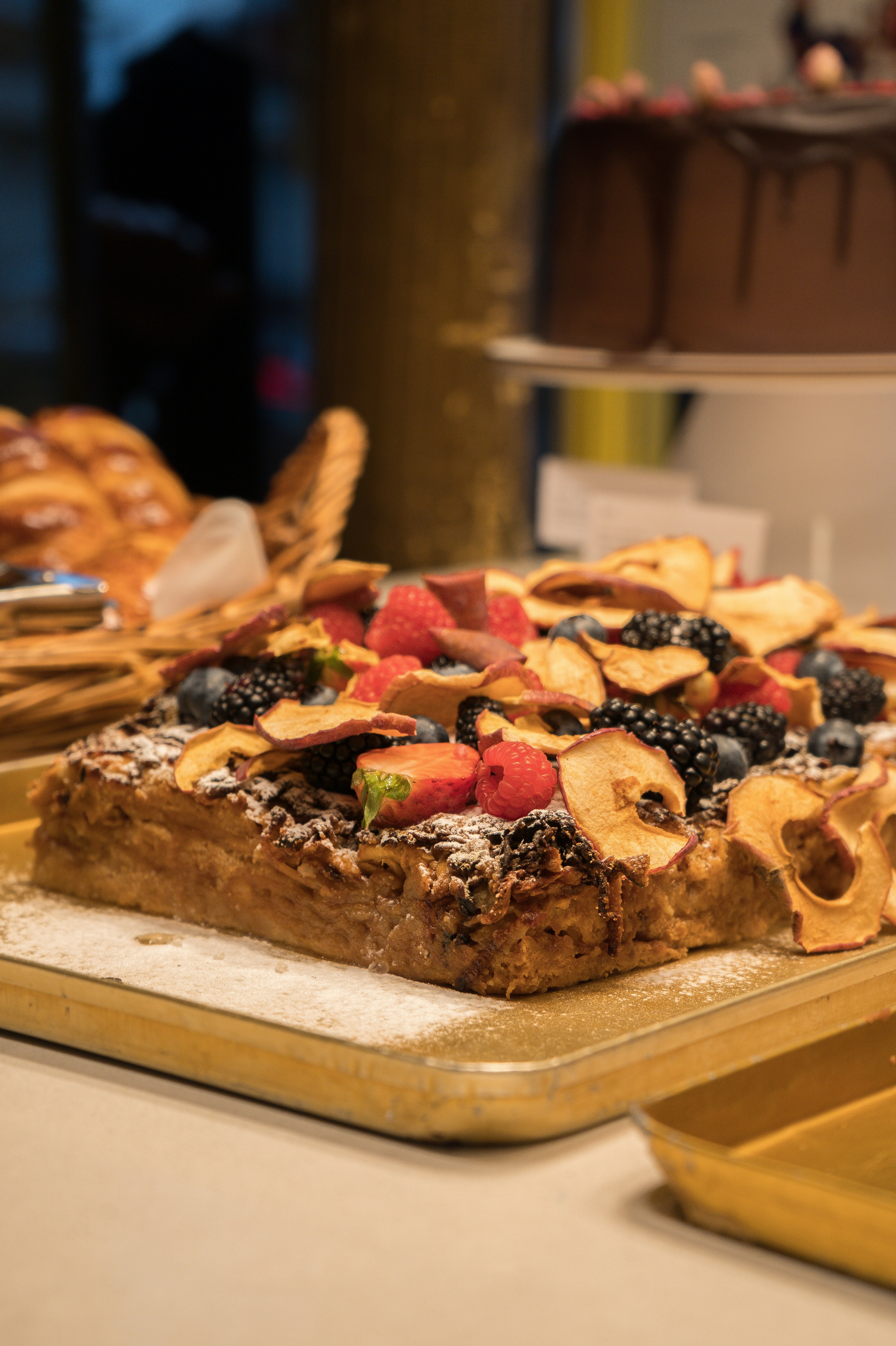 Caramel-framed berry tart crowned with dried apple crisps