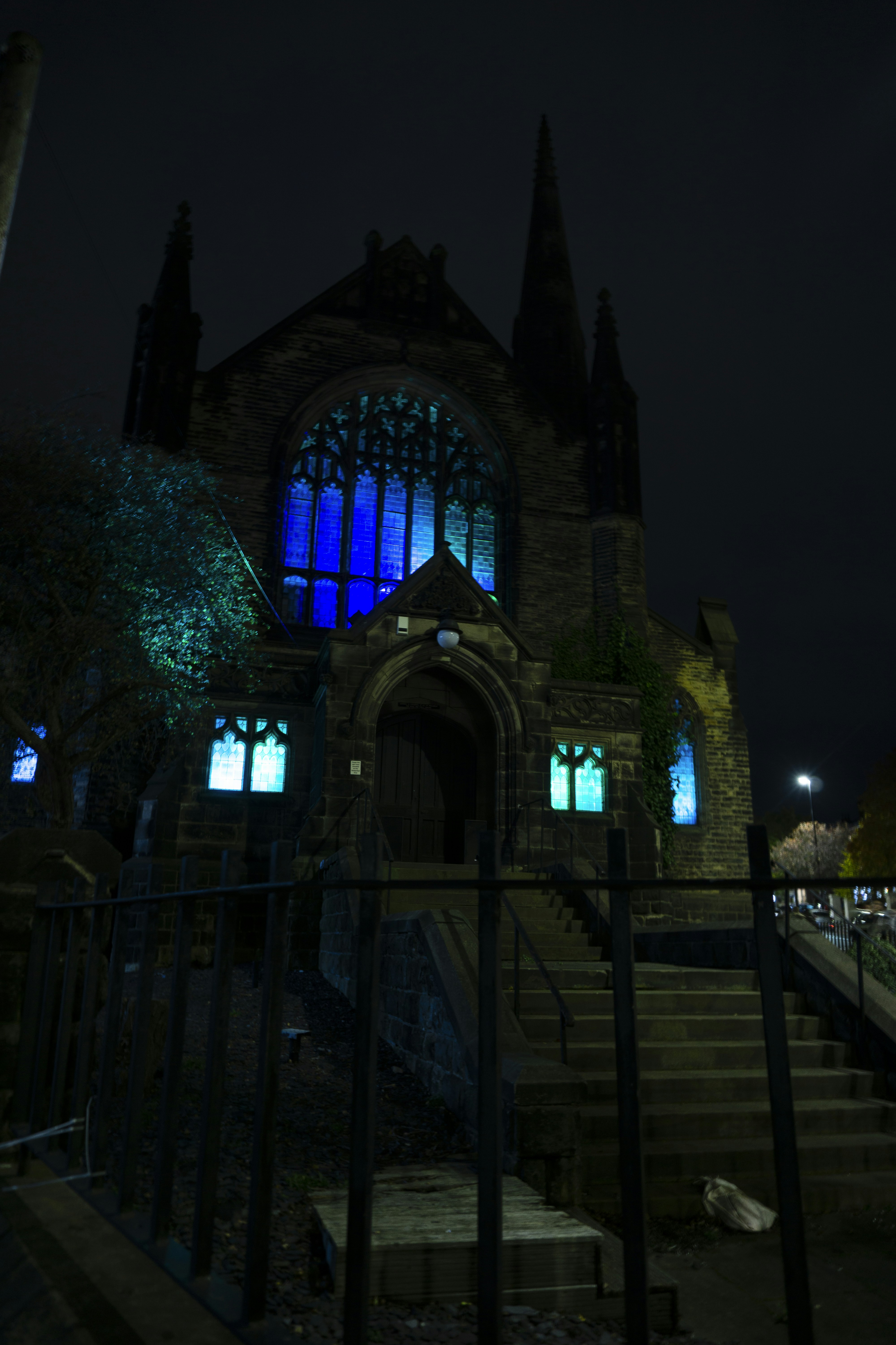 A church lit up with blue lights at night photo – Free Leeds Image on ...