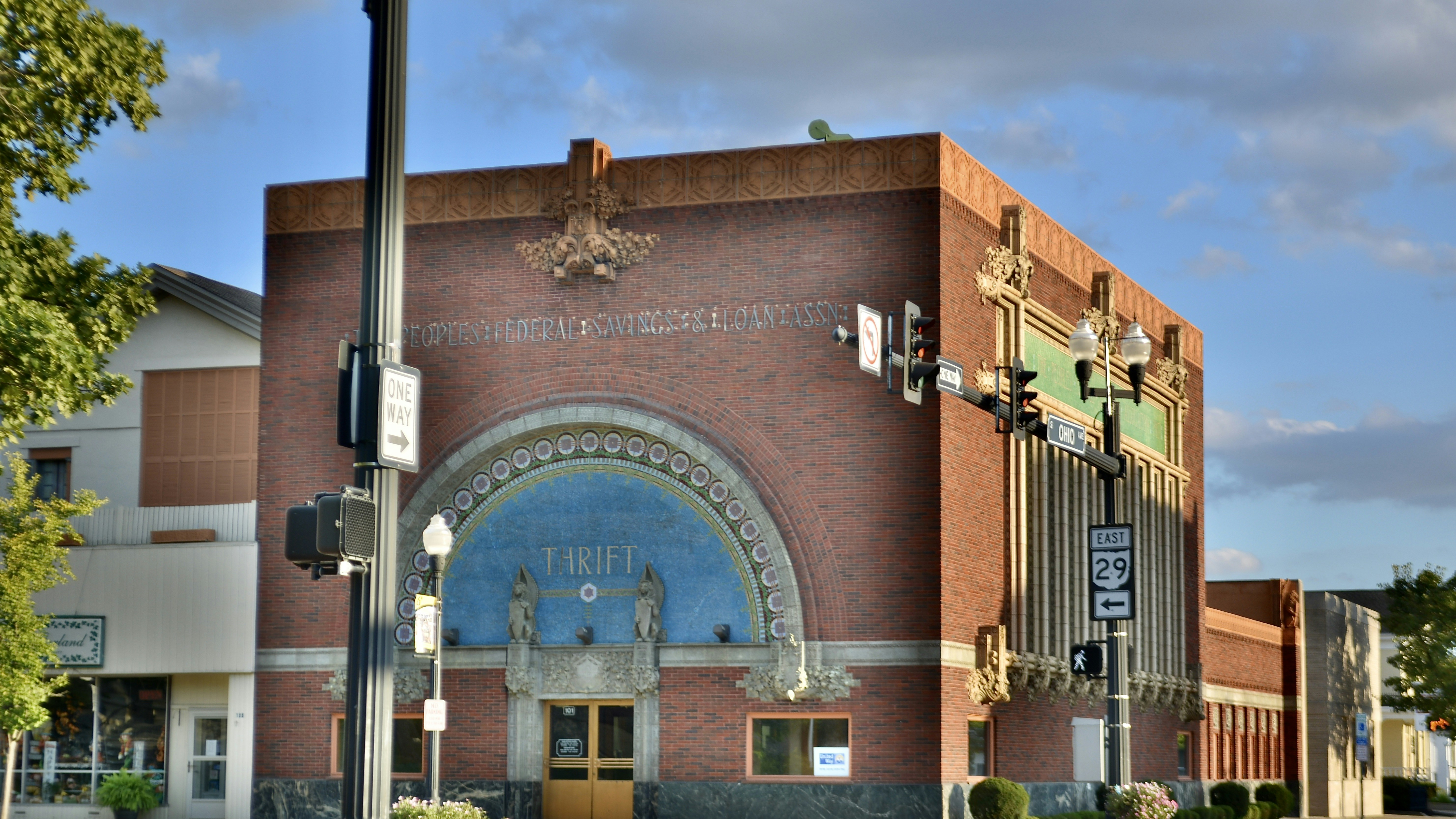 A large building with a clock on the front of it