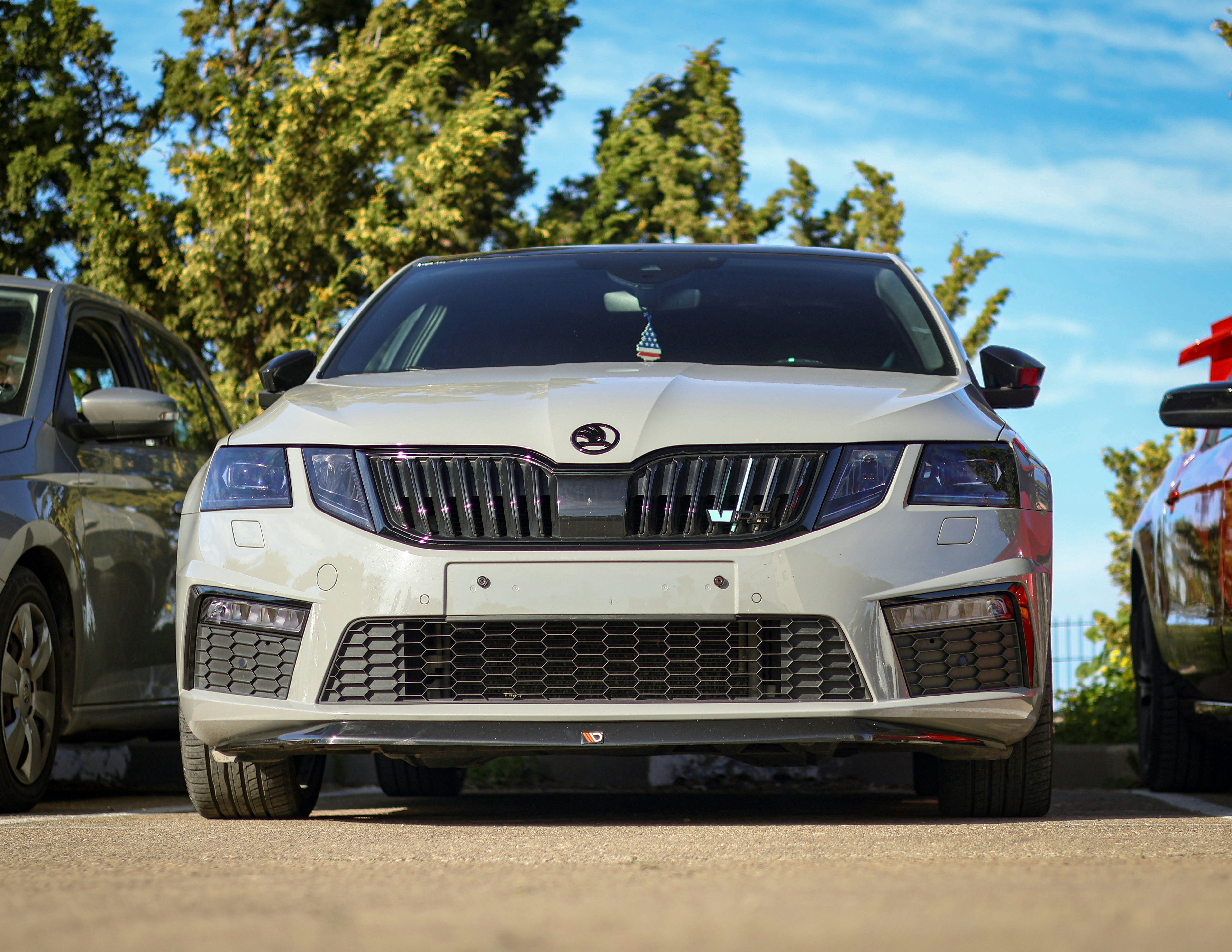 A couple of cars parked next to each other photo – Free Car Image on ...