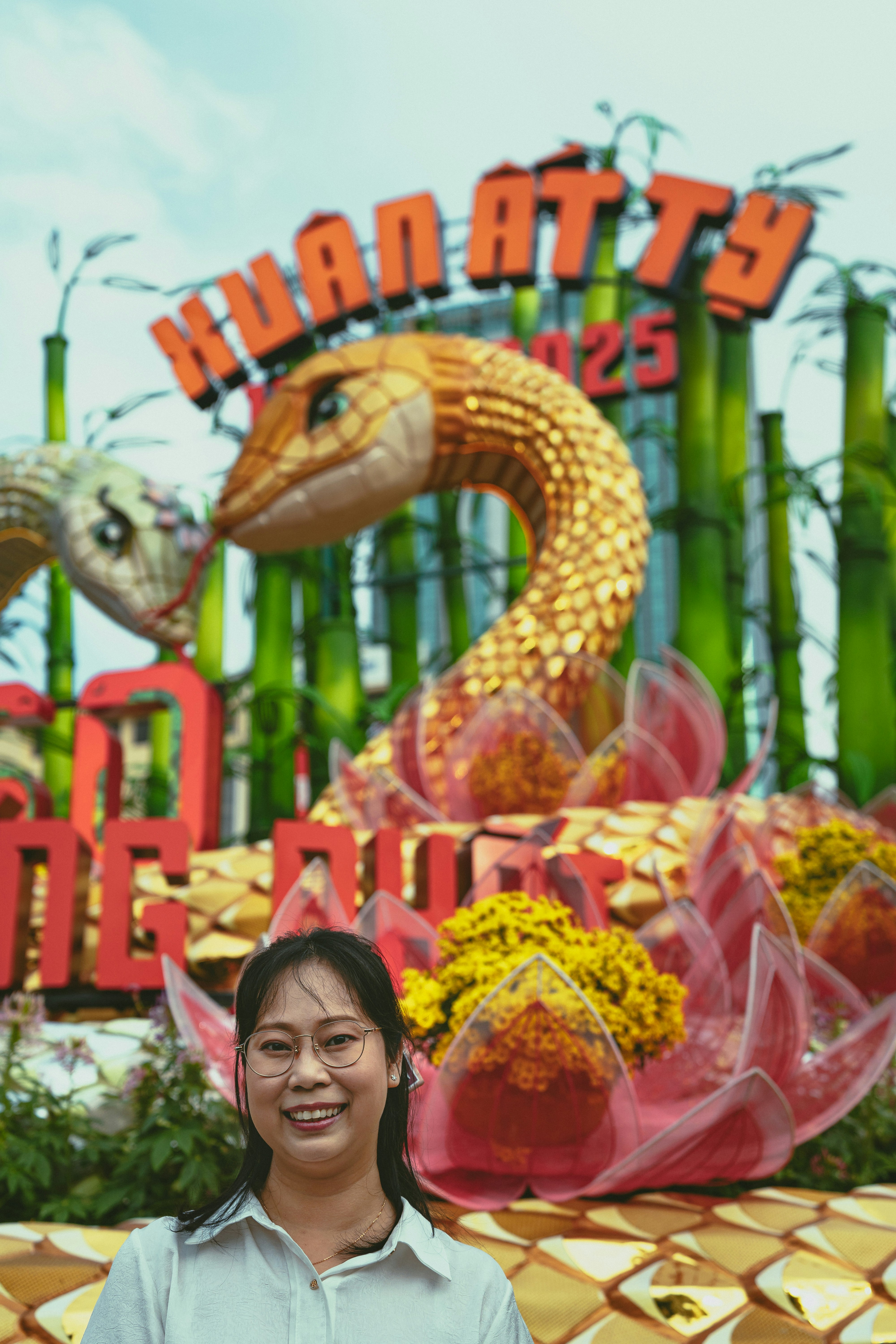 Portrait in Front of a Neon Dragon and Lotus Festival Backdrop