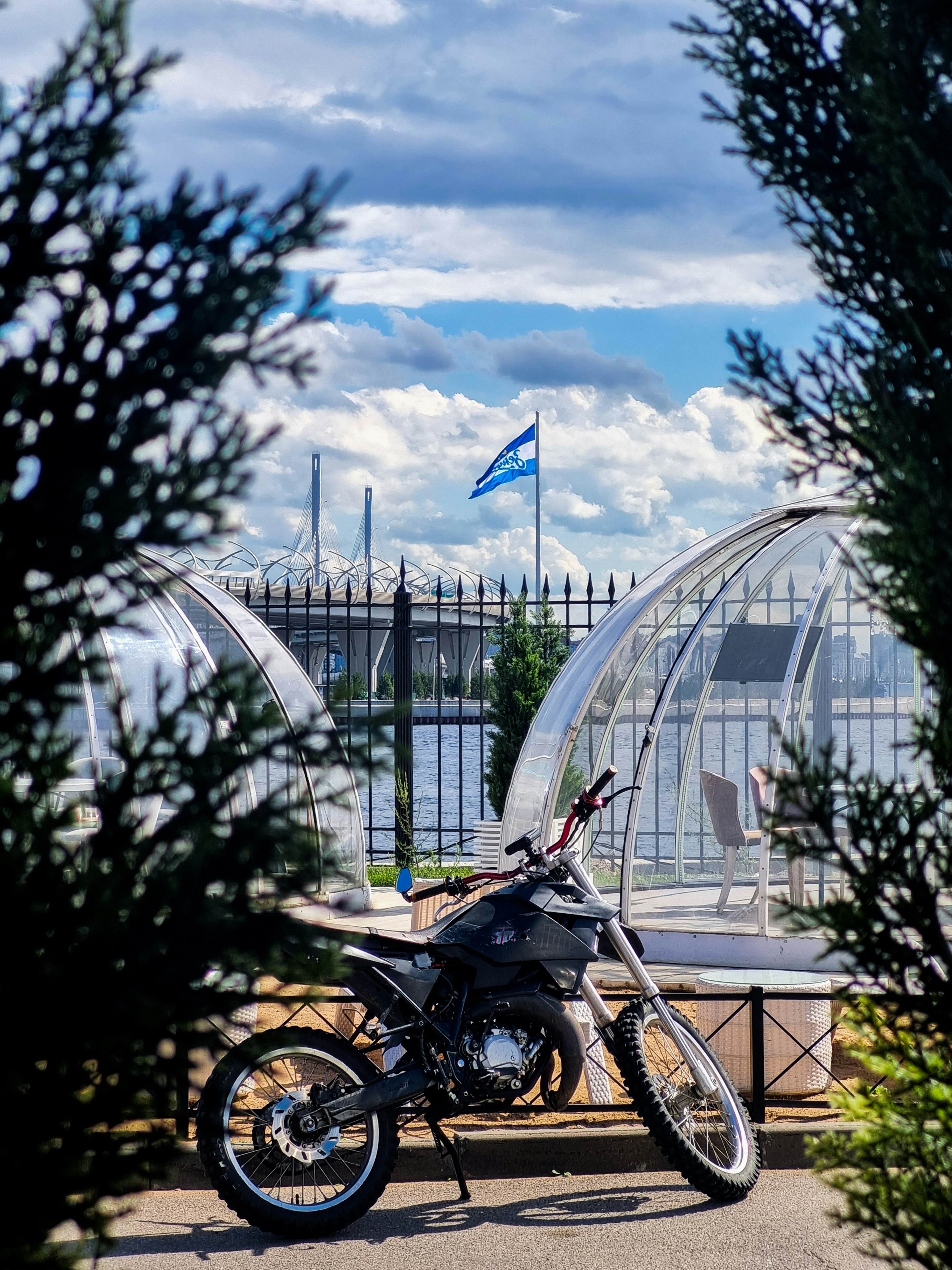 Moto by the Glass Harbor: A Quiet Waterfront Moment