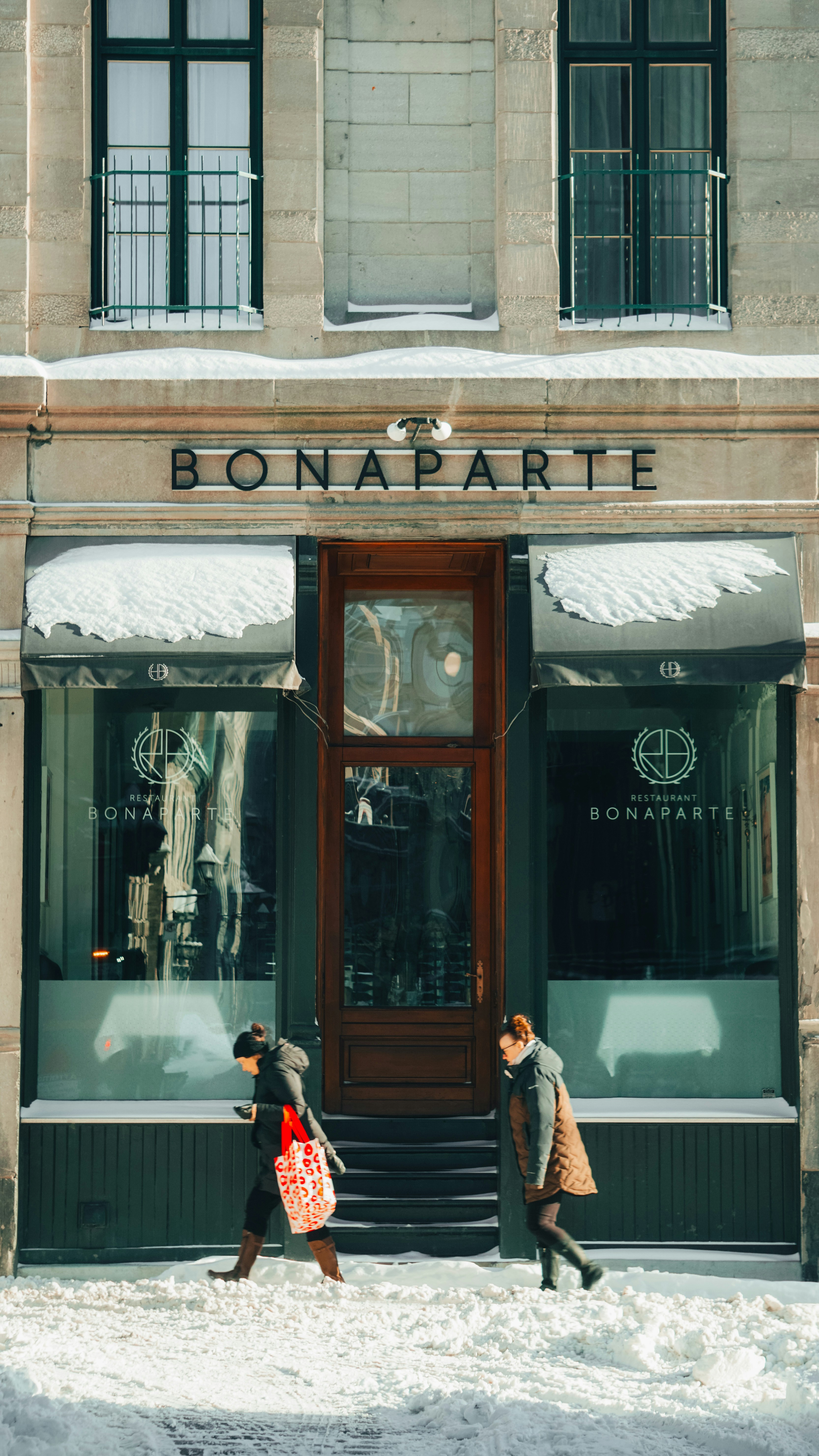 Bonaparte Shopfront in Snow: Quiet City Snowfall and Pedestrians