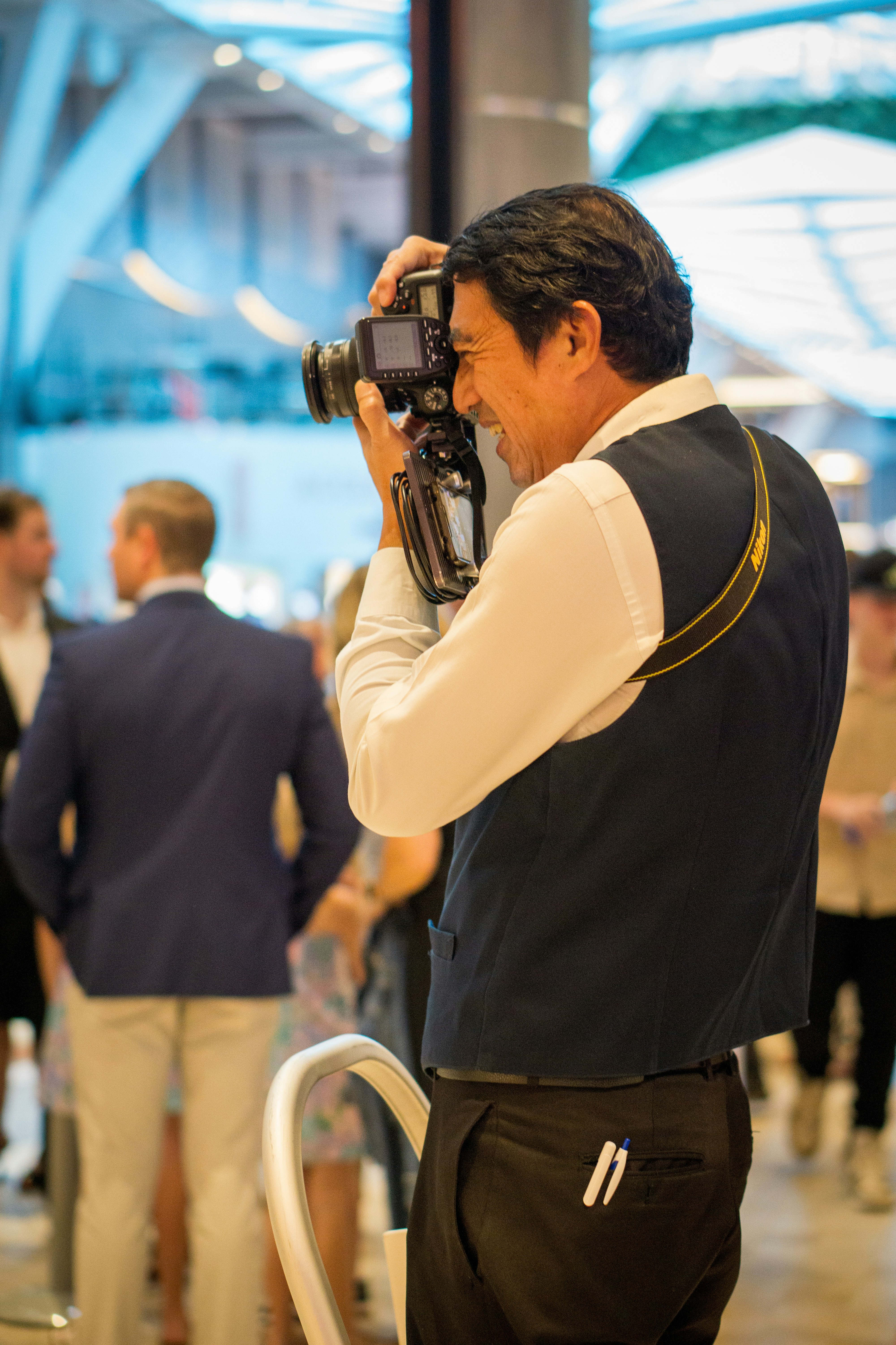 A man taking a picture of a group of people photo – Free Photo Image on ...