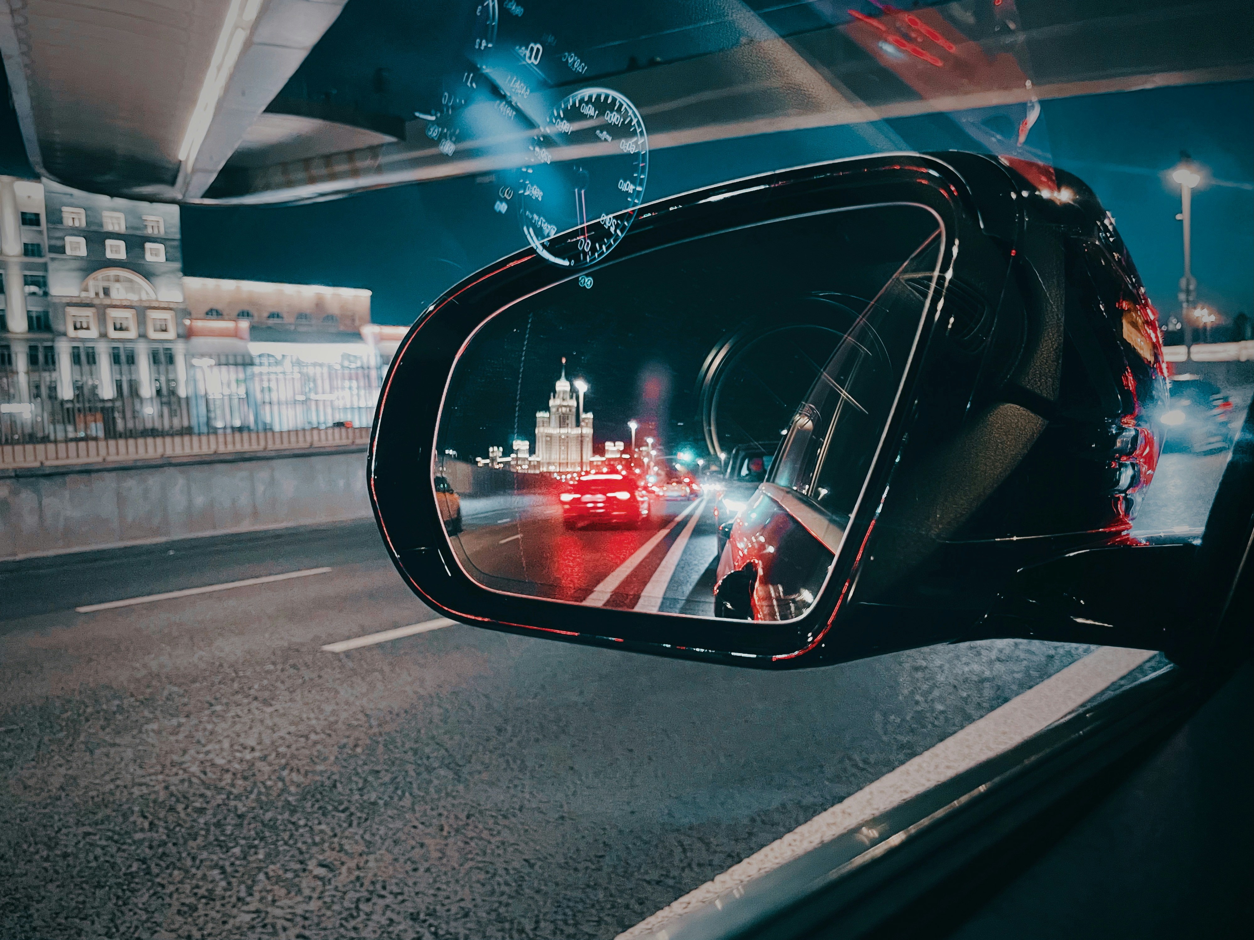 Night Drive Reflection: City Lights in a Car Mirror