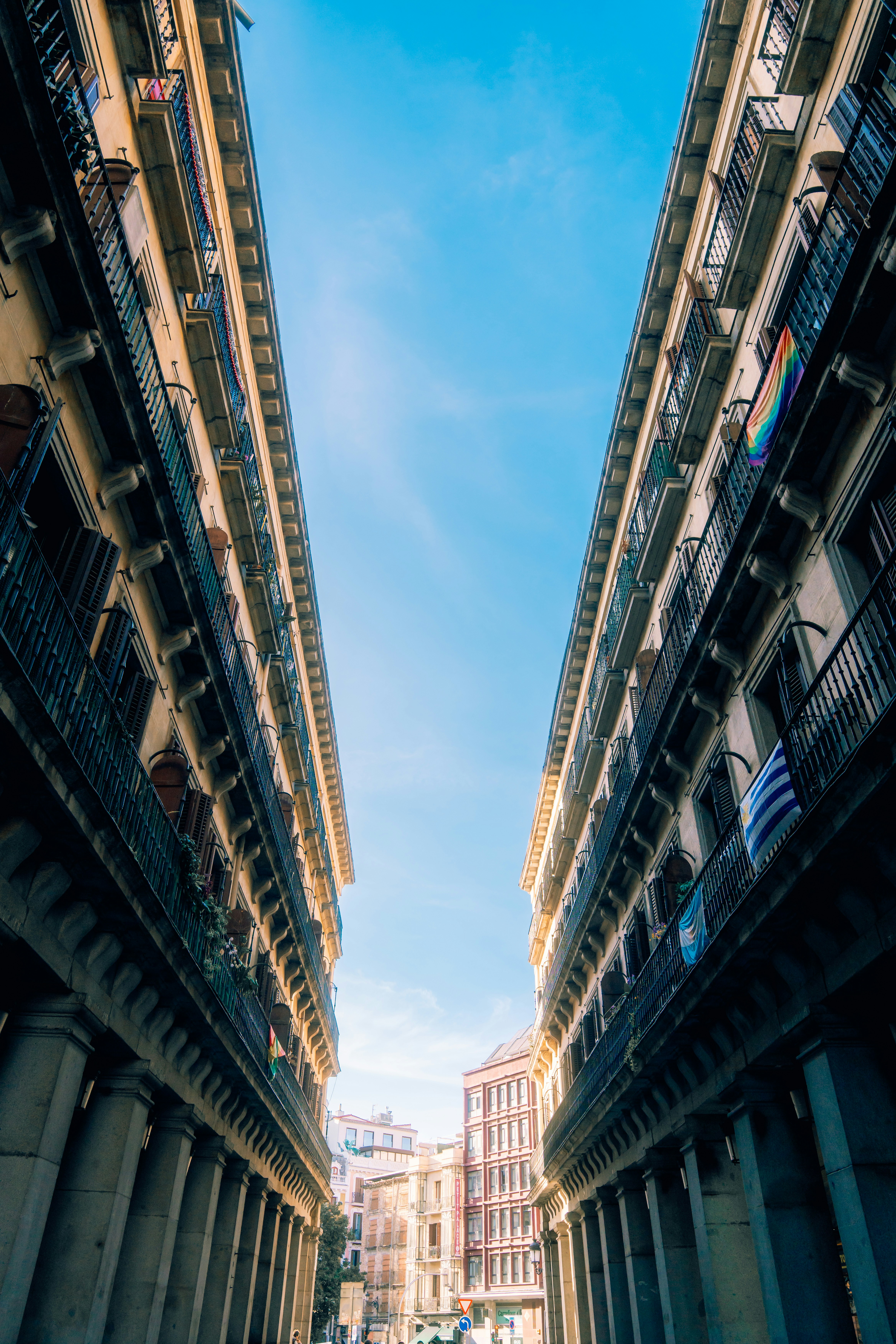 Skyward Canyon: Symmetry of Balconies Framing a Blue Cathedral