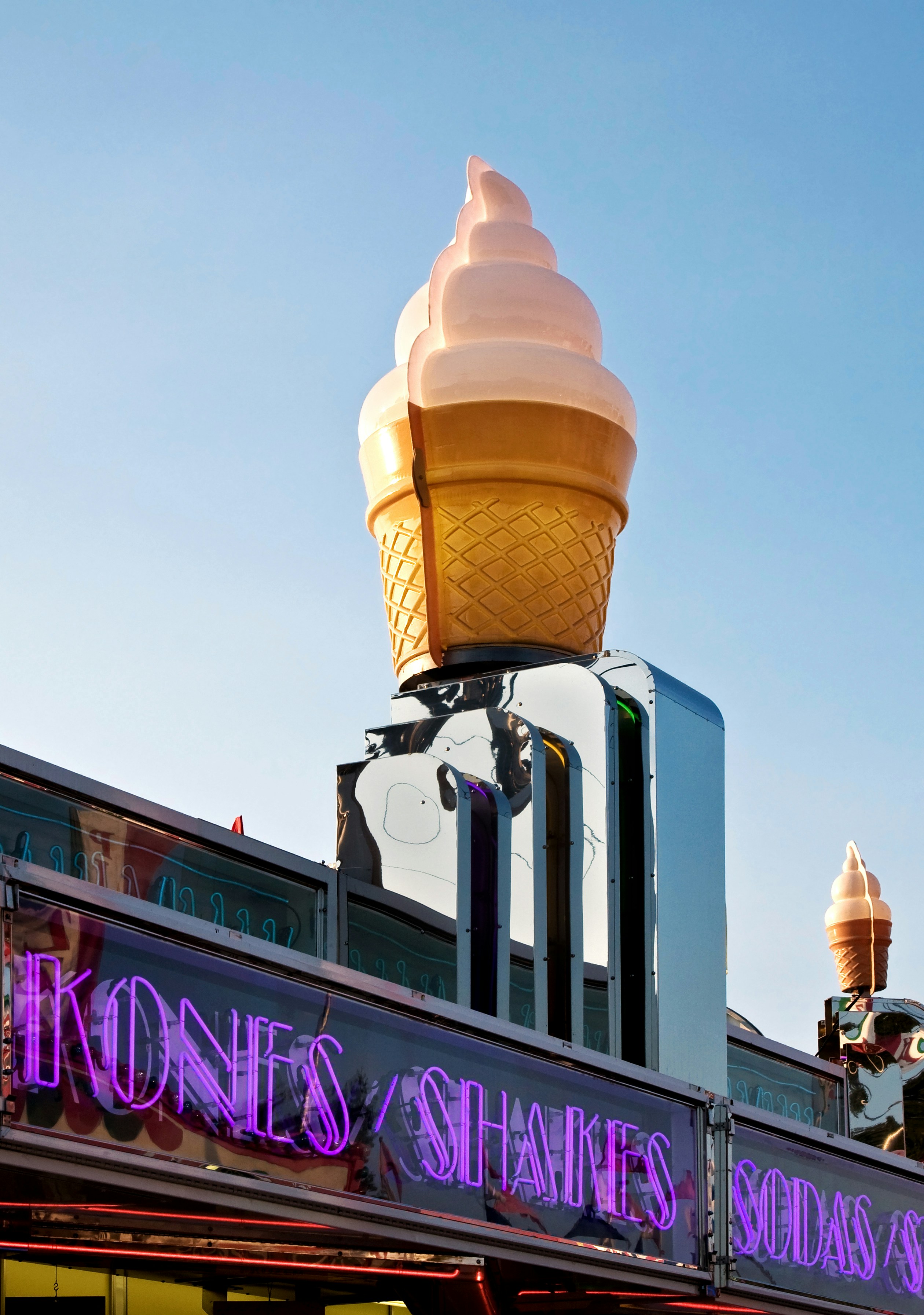 Ice Cream Peak Over Neon Rides
