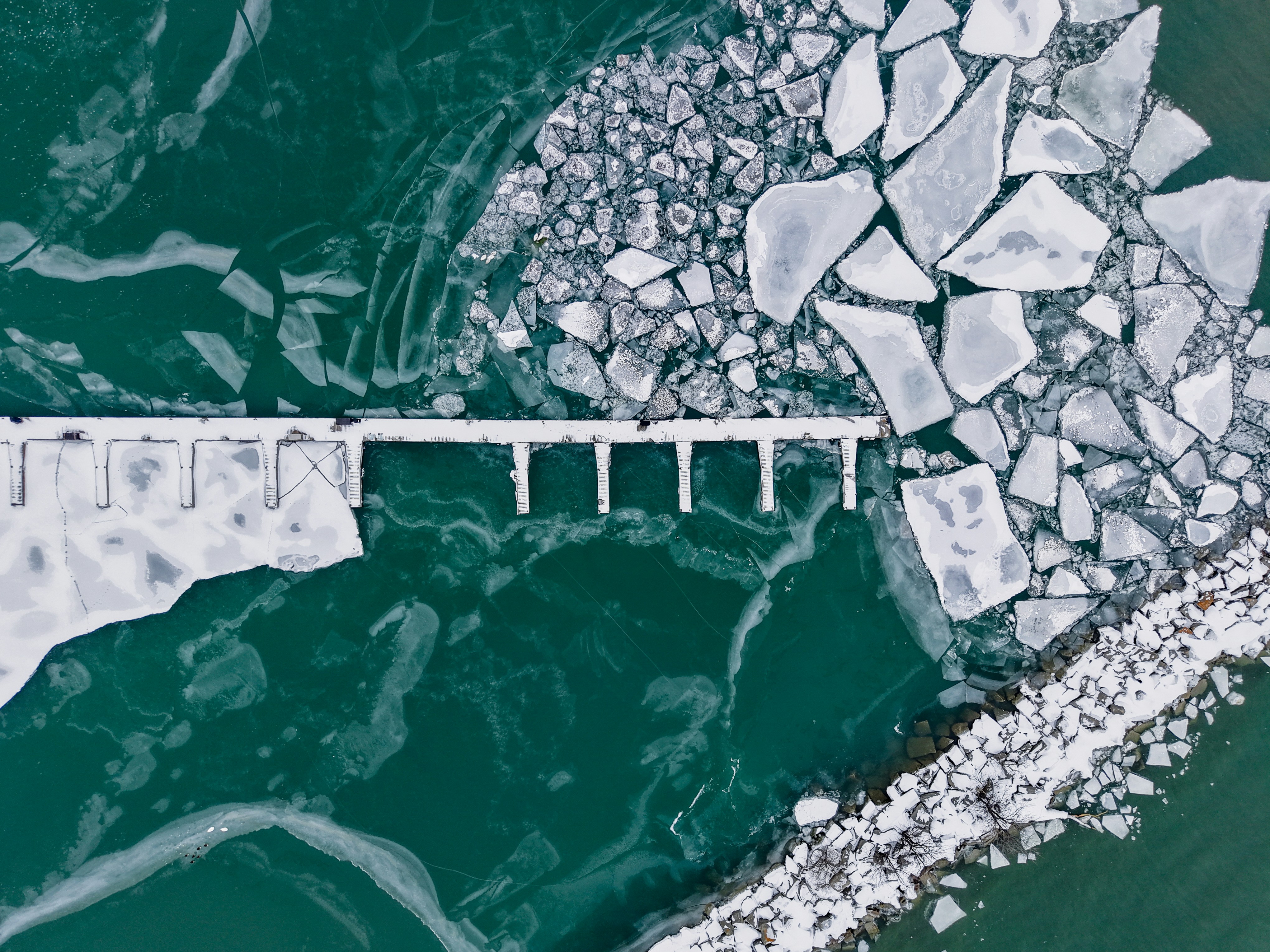 Icebound Jetty: An Aerial Study of a Frozen Shoreline