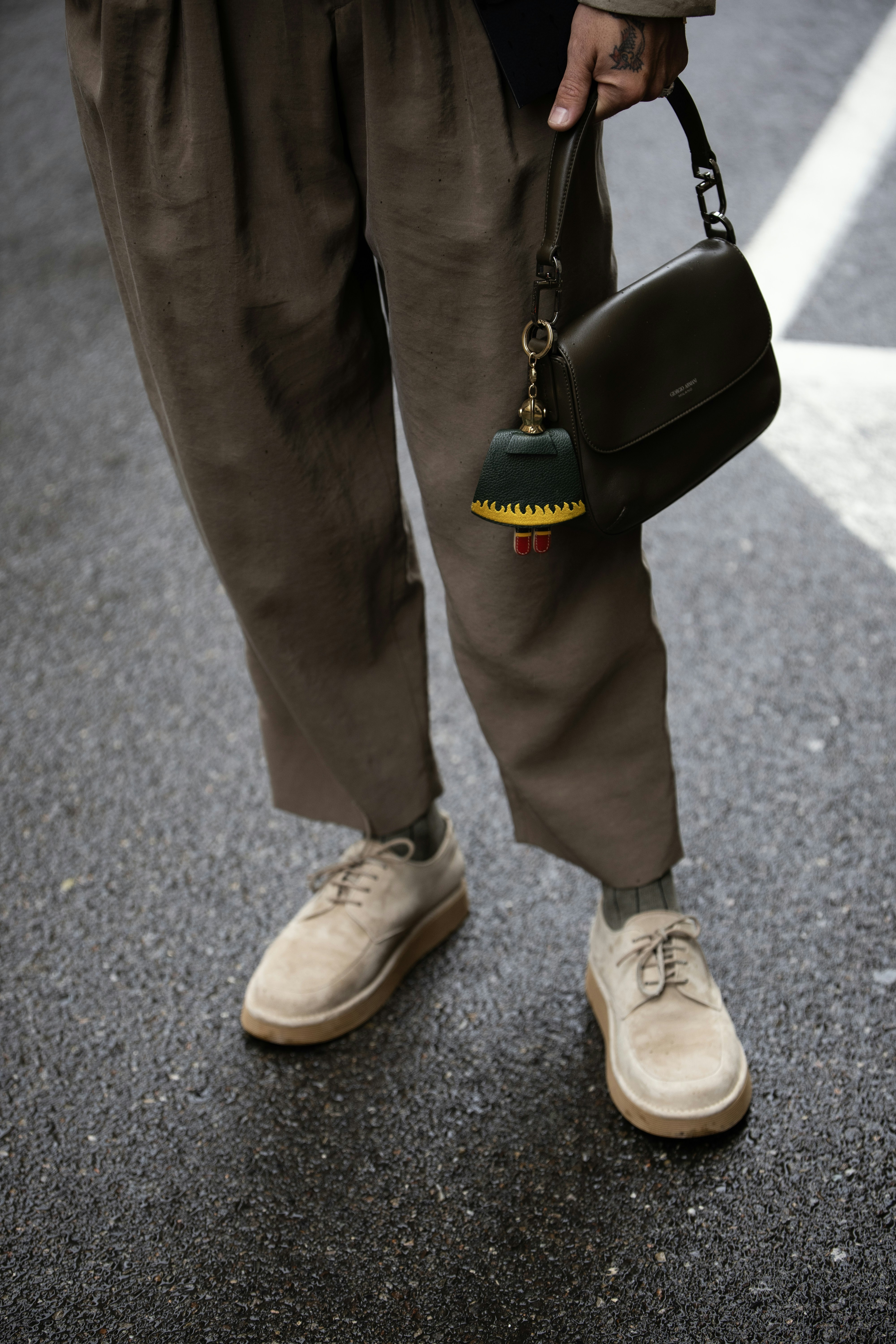 A person holding a purse and a handbag photo – Free Italy Image on Unsplash