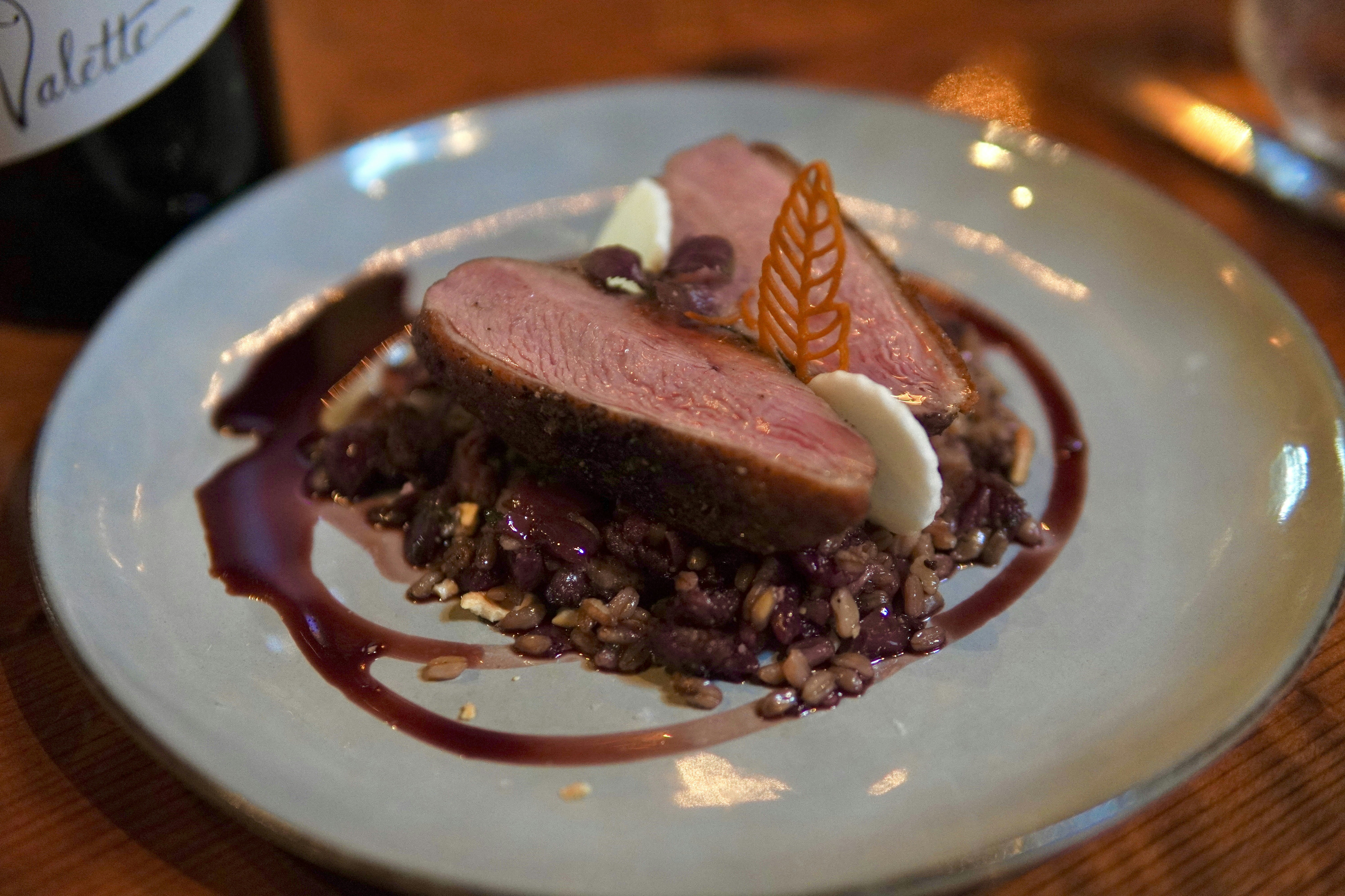 Pan-seared Duck Breast with Red Wine Reduction over Cherry-Gristle Risotto