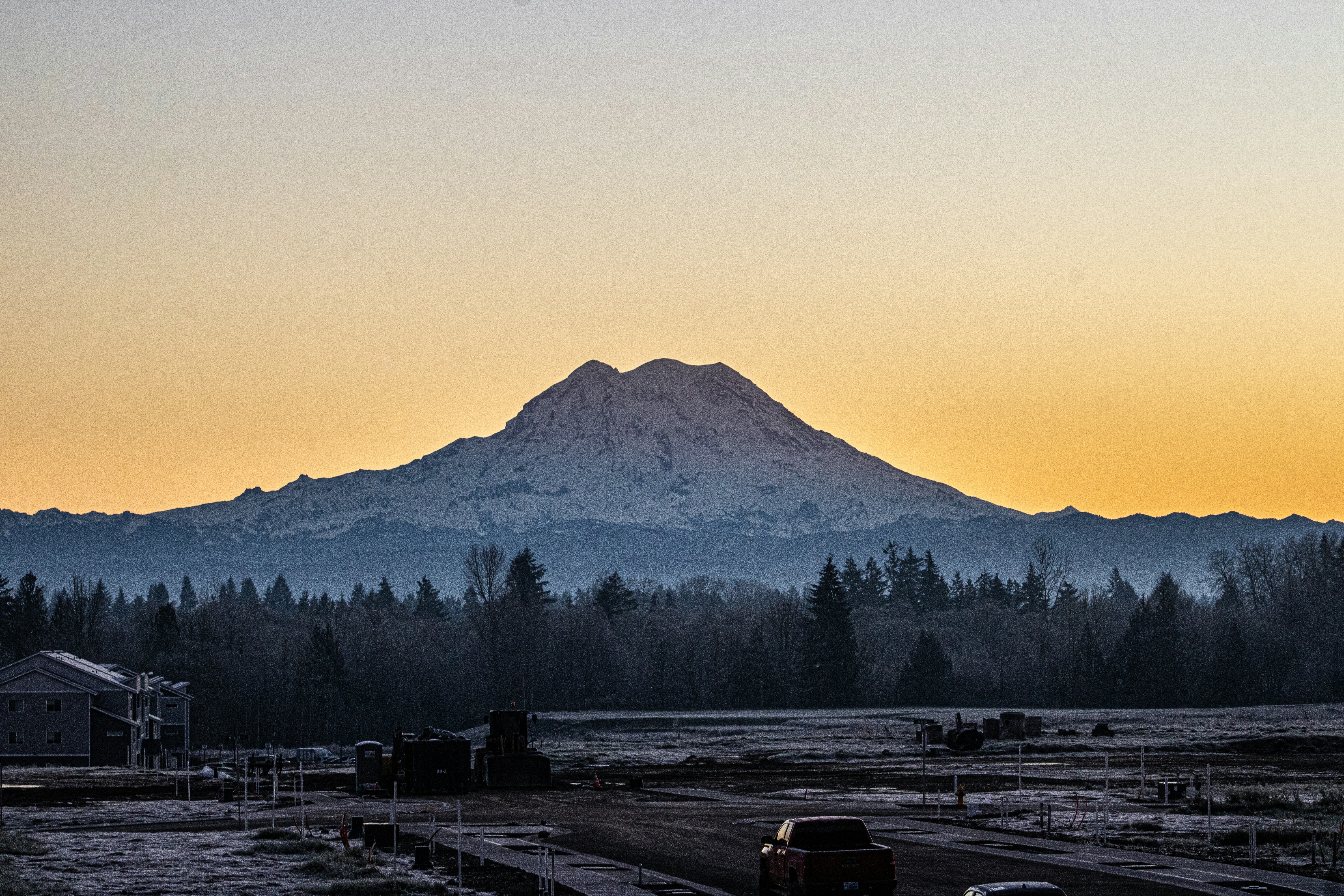 Serene Dawn Over Snow-Capped Peaks