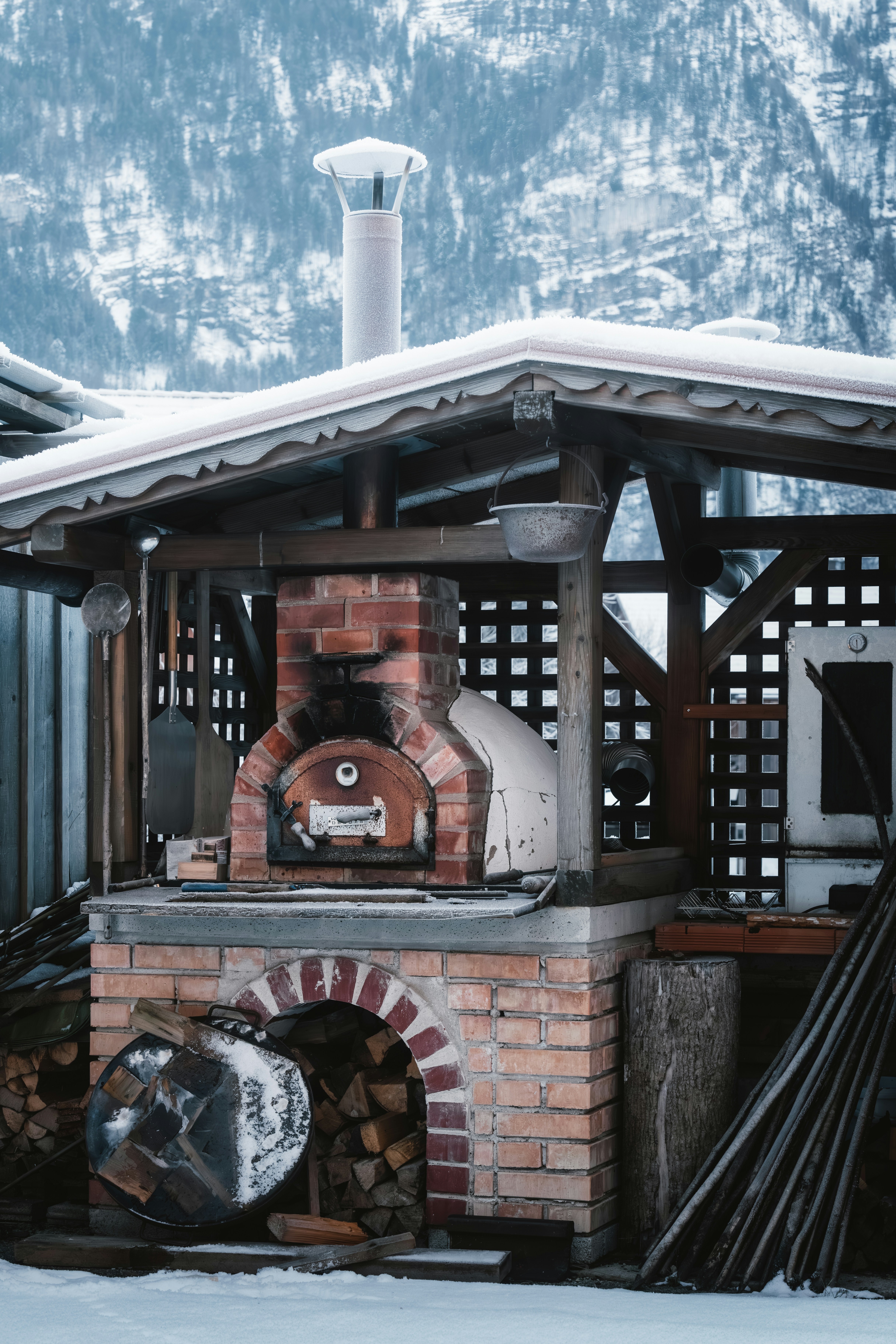Rustic Brick Oven in Snowy Mountains from Hallstatt Austria
