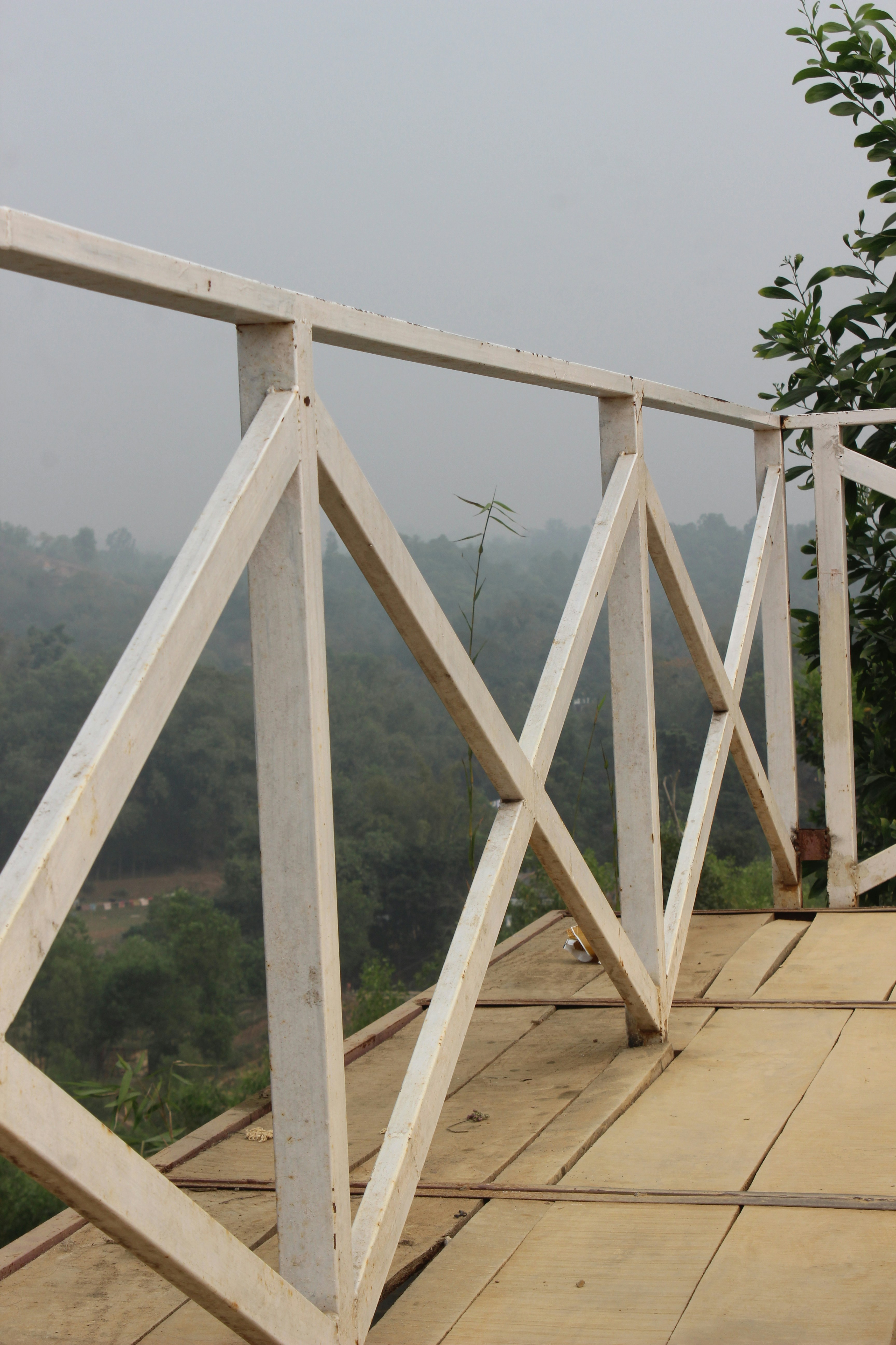 Crisscrossed Rails Over a Misty Valley