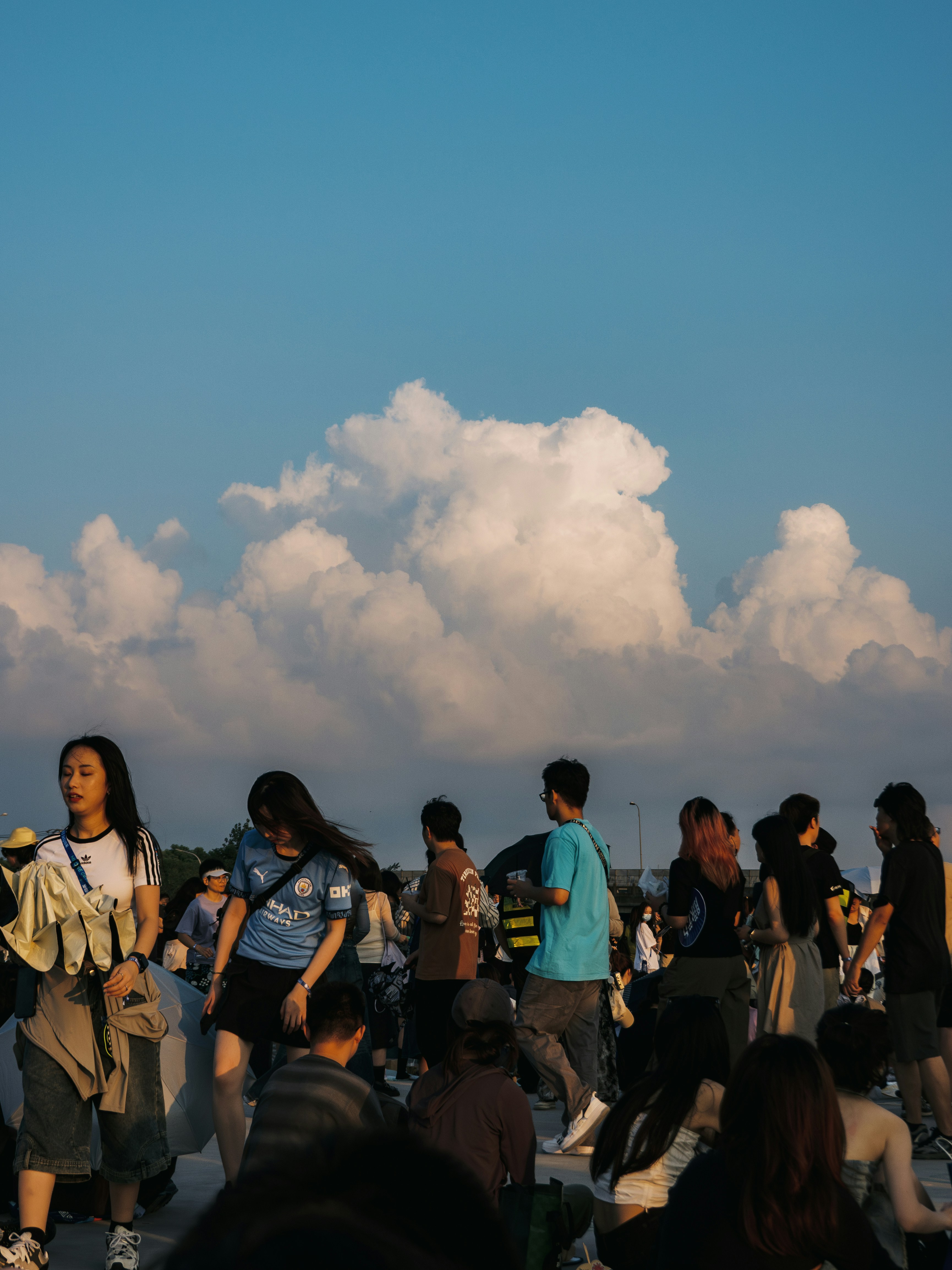 A crowd of people standing around each other photo – Free Photo Image ...