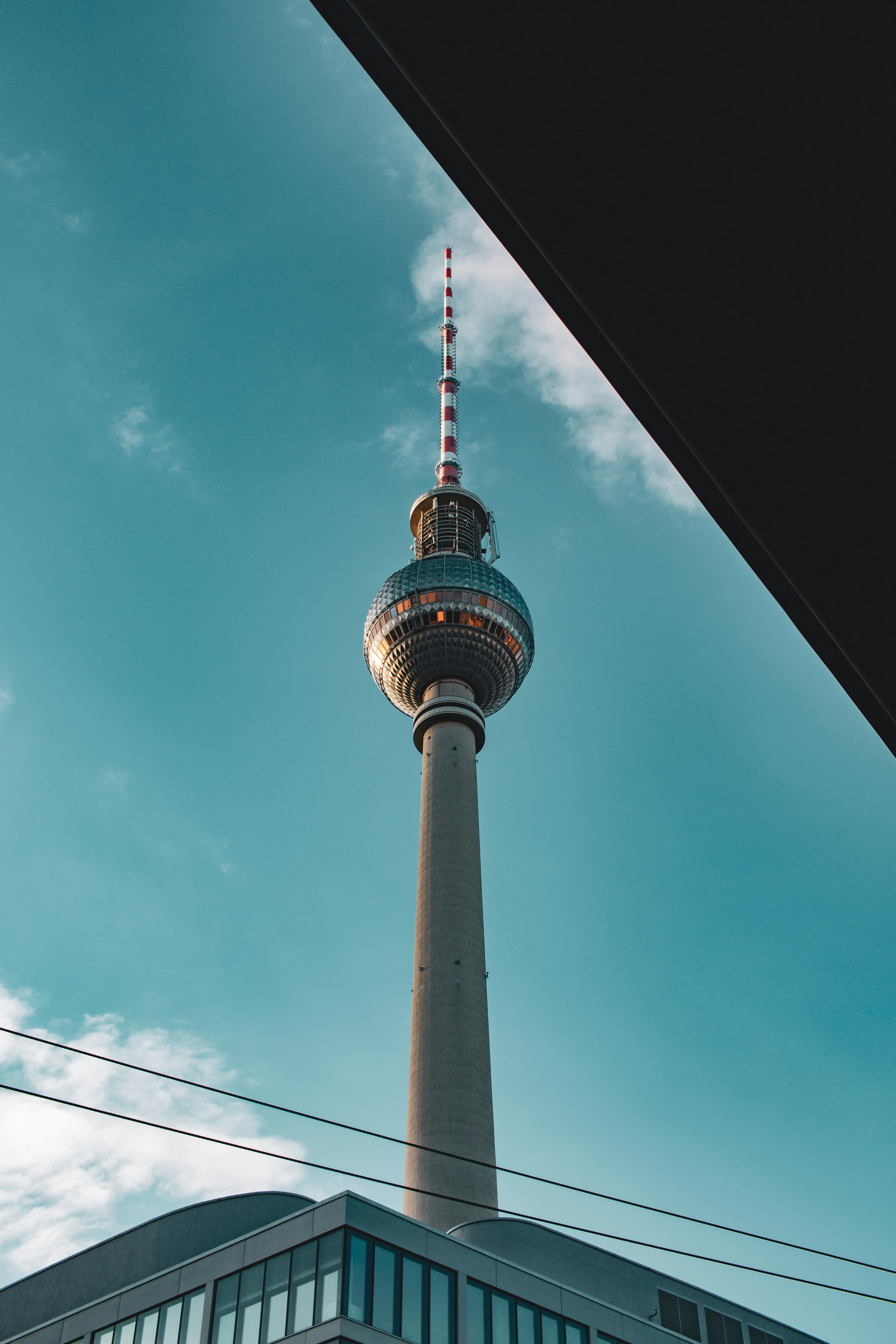 "Fernsehturm" in Berlin, Alexanderplatz. | A tall tower with a sky background
