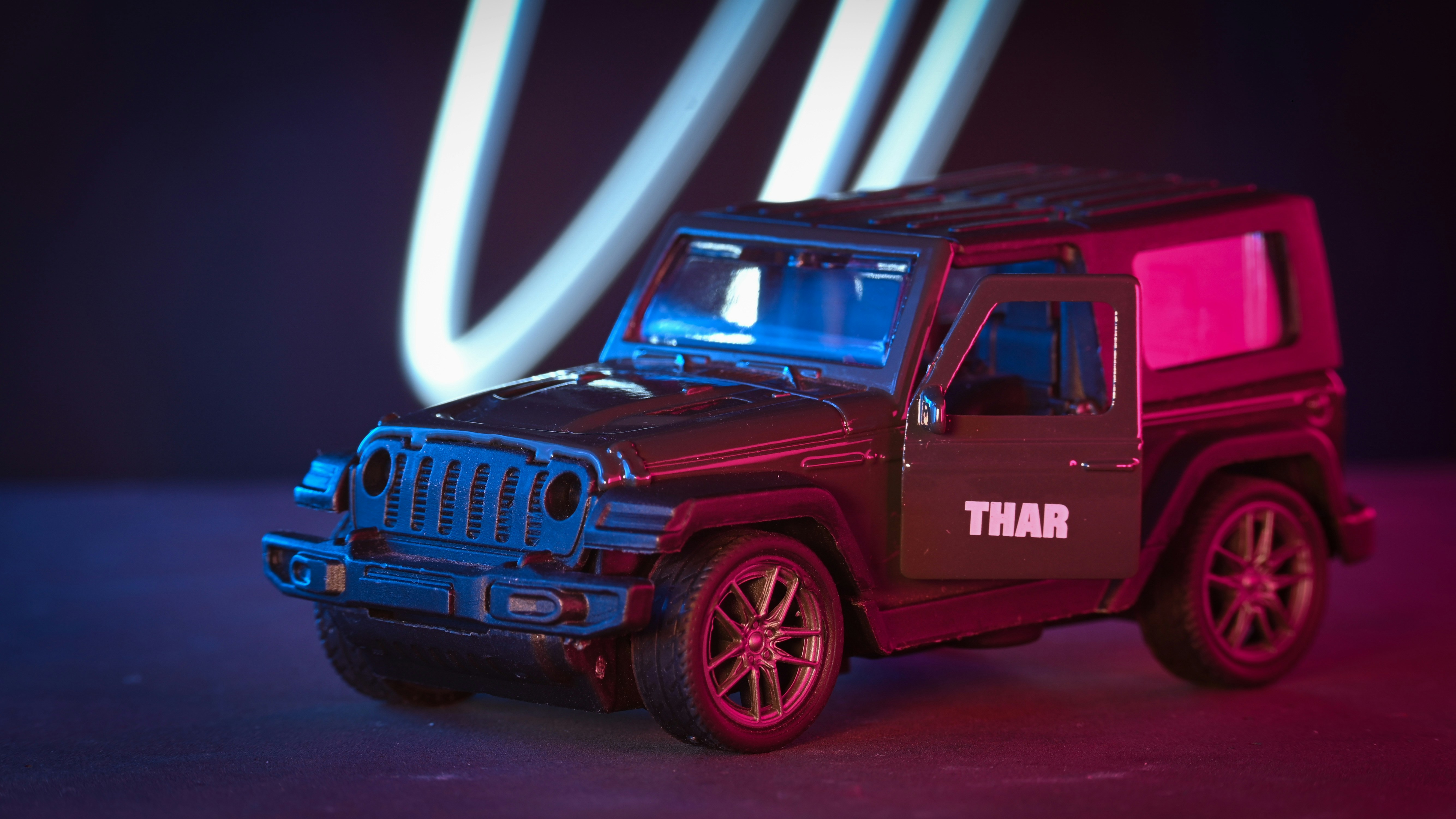 A toy jeep with a neon light on it photo – Free Car Image on Unsplash