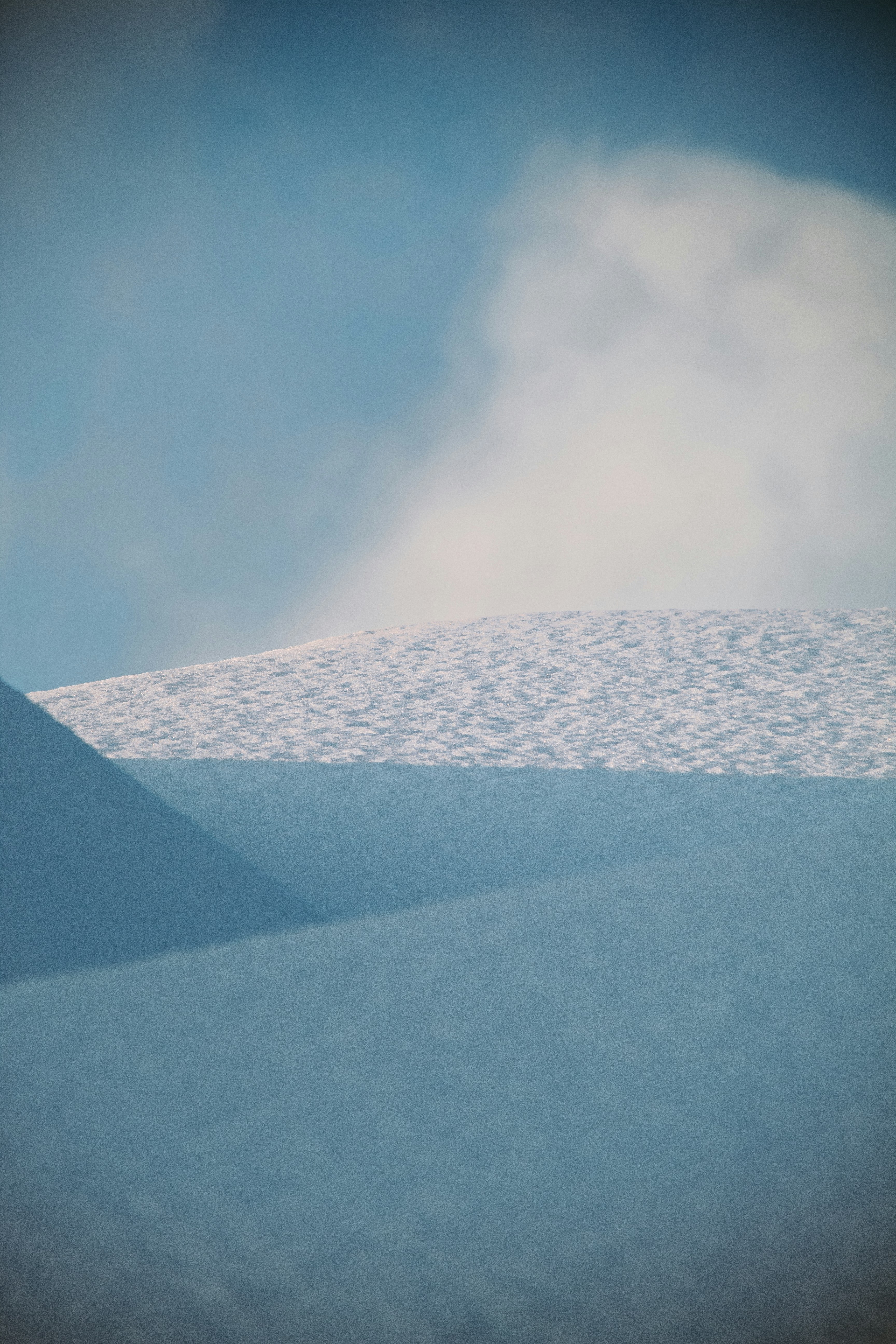 Azure Dunes: Snow Ridges Beneath a Quiet Sky