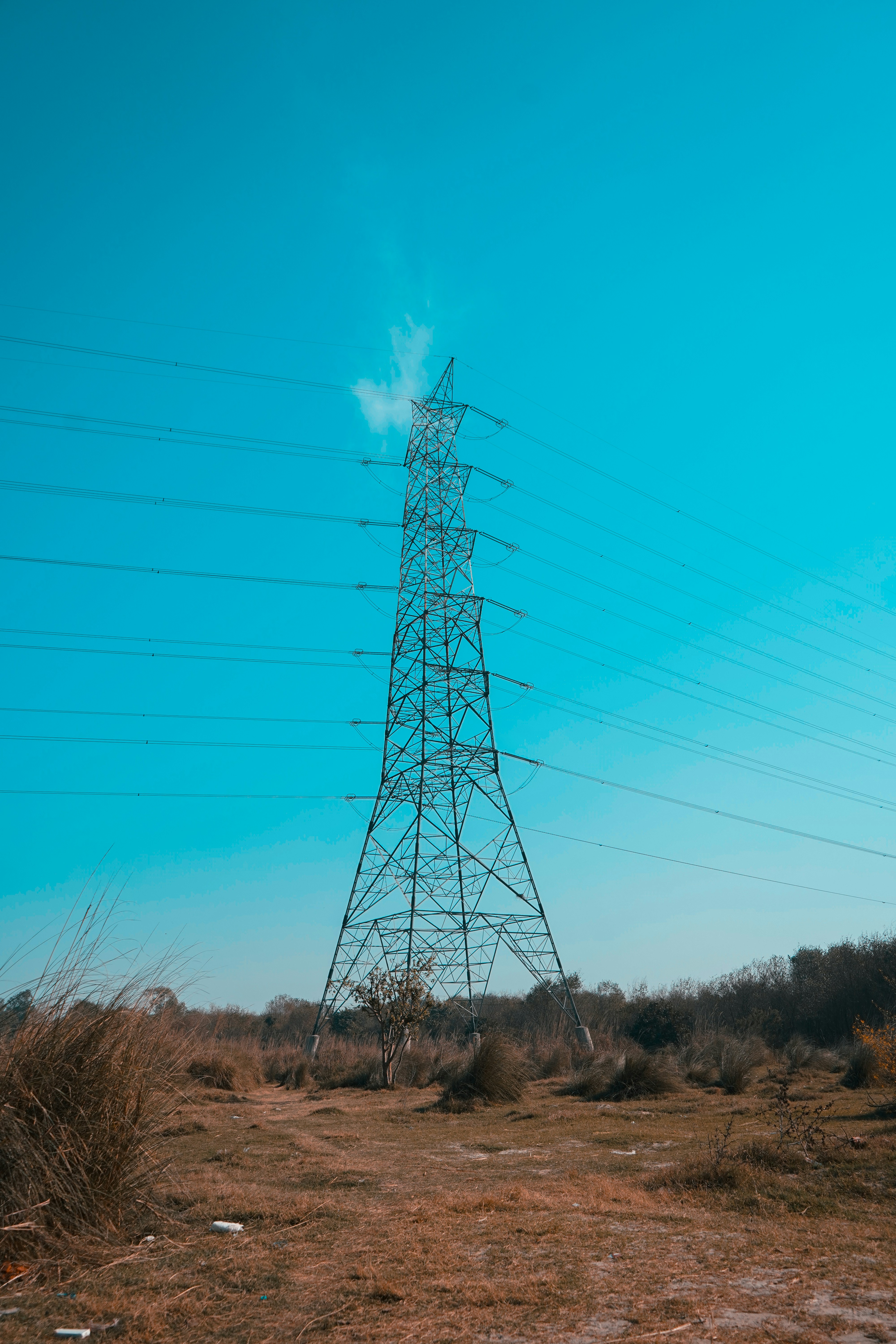 Azure Sky and Steel Sentinel: The Desert Transmission Tower