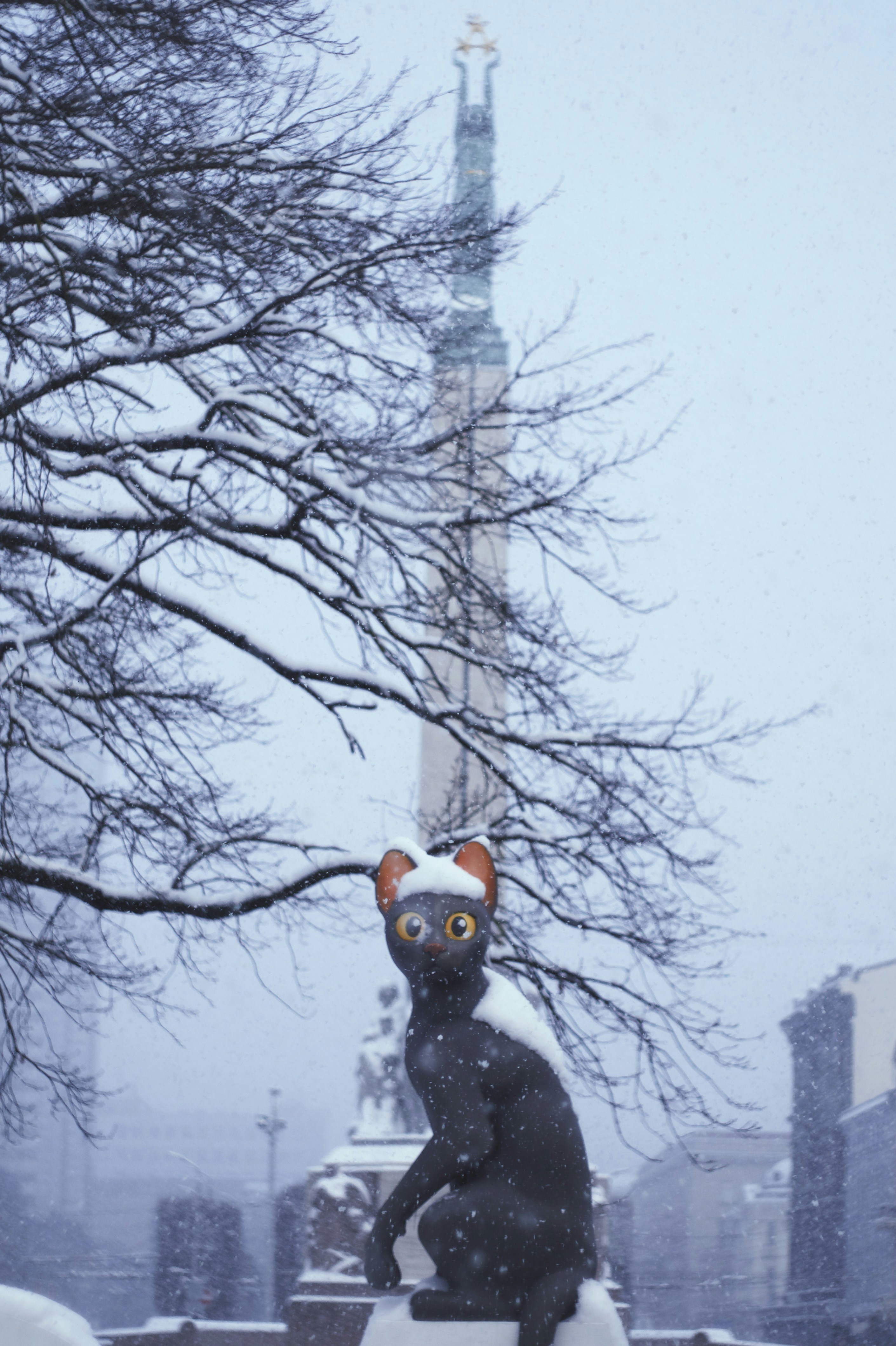 Snowy Cathedral Backdrop with a Curious Cat Statue