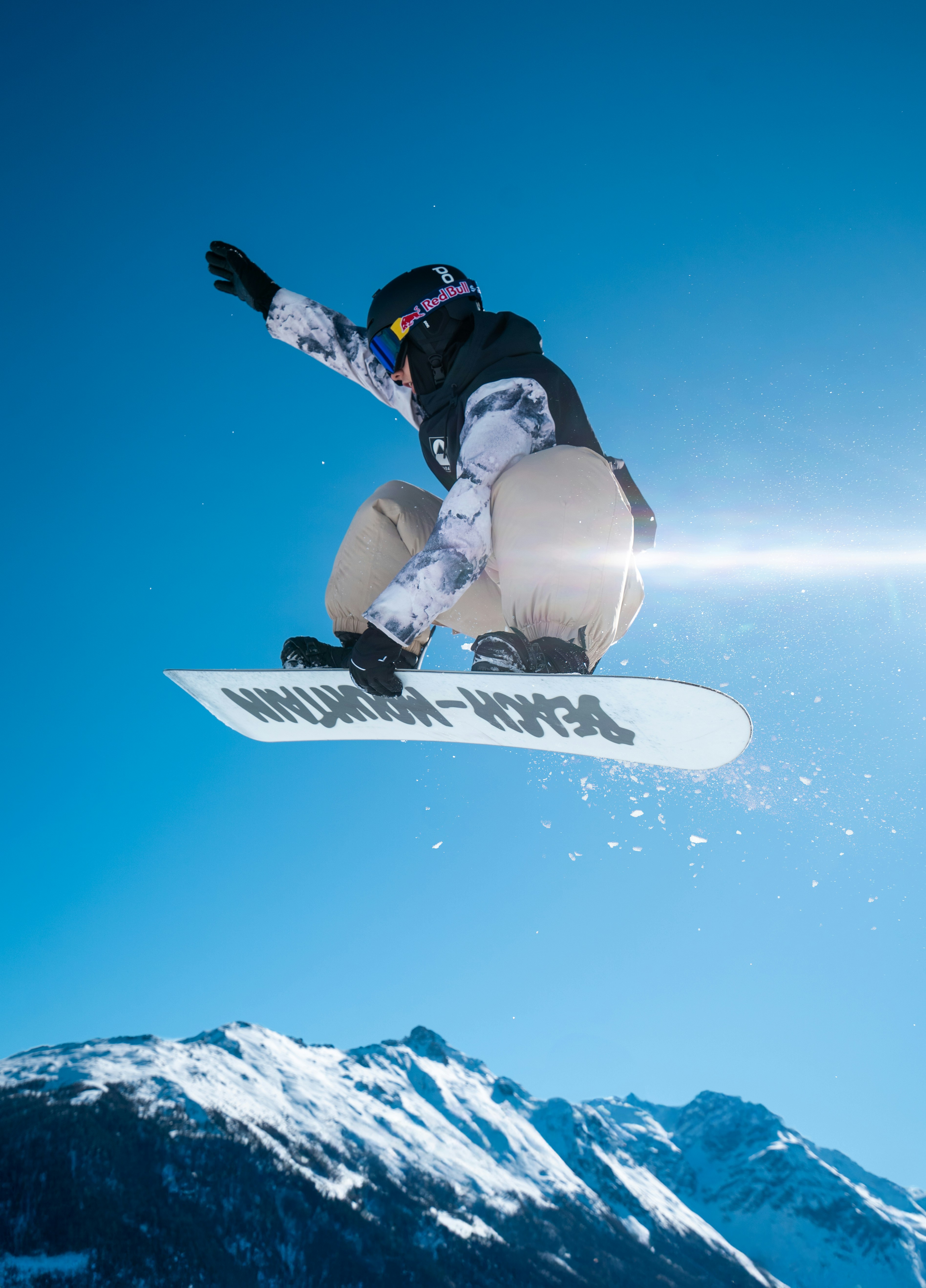 A person on a snowboard jumping in the air photo – Free Man Image on ...