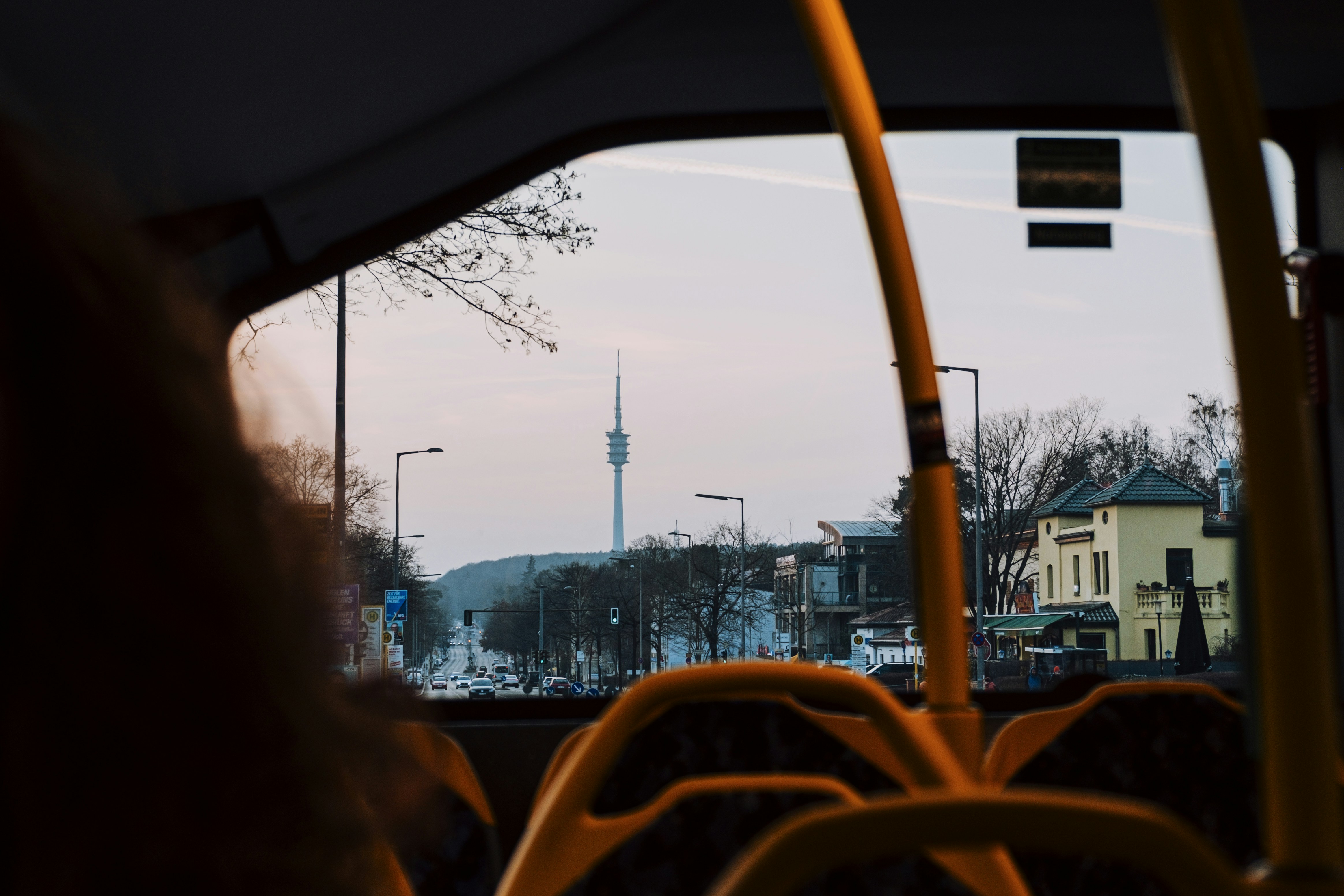 Transit Gaze: A Tower Emerges Beyond the Bus Window