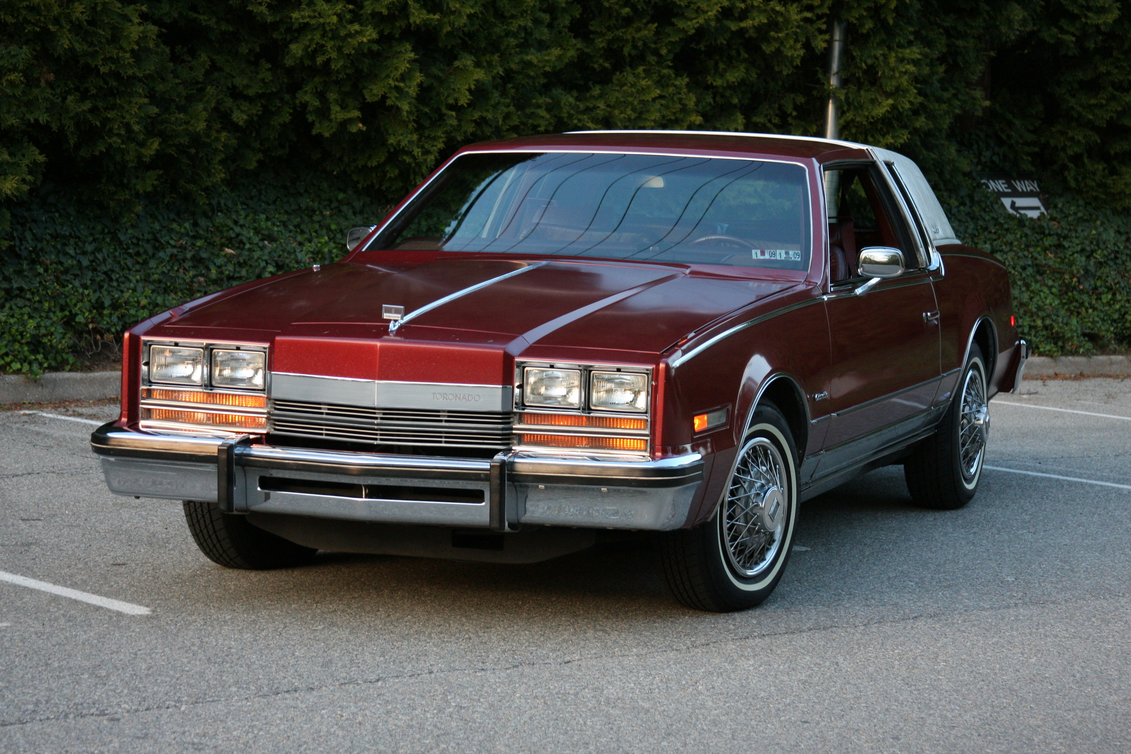 A maroon station wagon parked in a parking lot photo – Free Oldsmobile ...