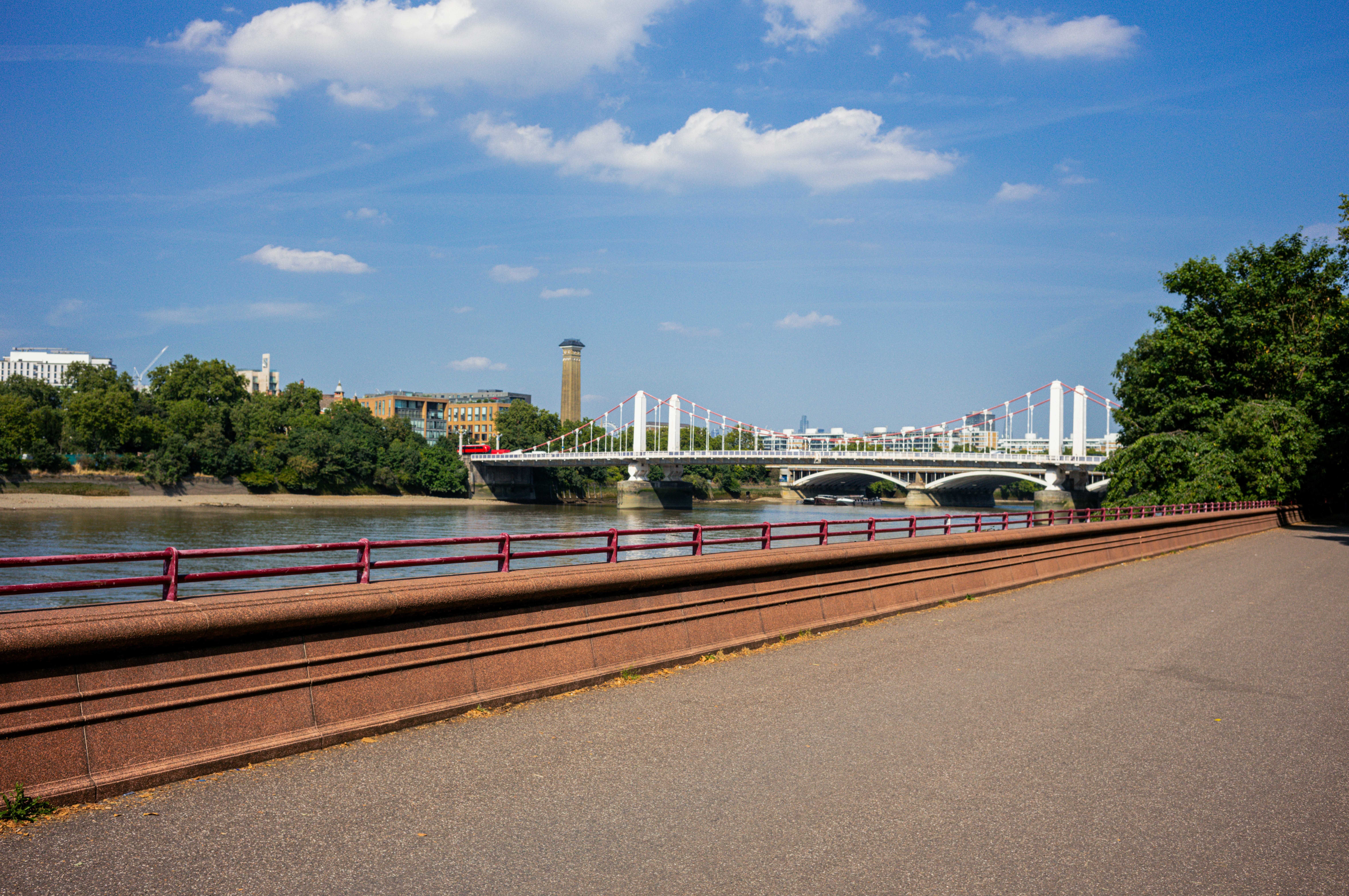 Riverside Bridge Scene under a Bright Blue Sky