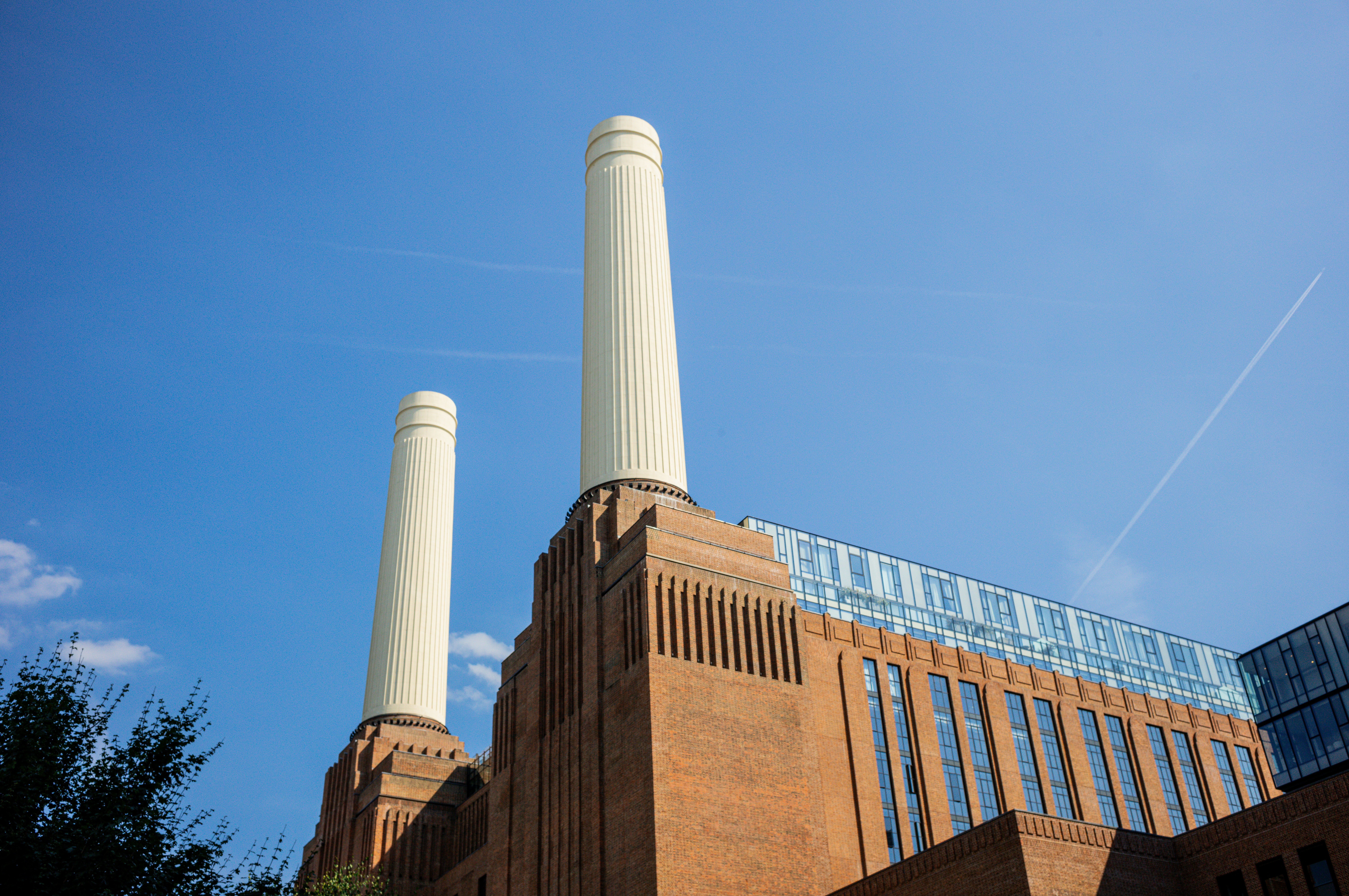 A tall brick building with two white smoke stacks photo – Free Building ...