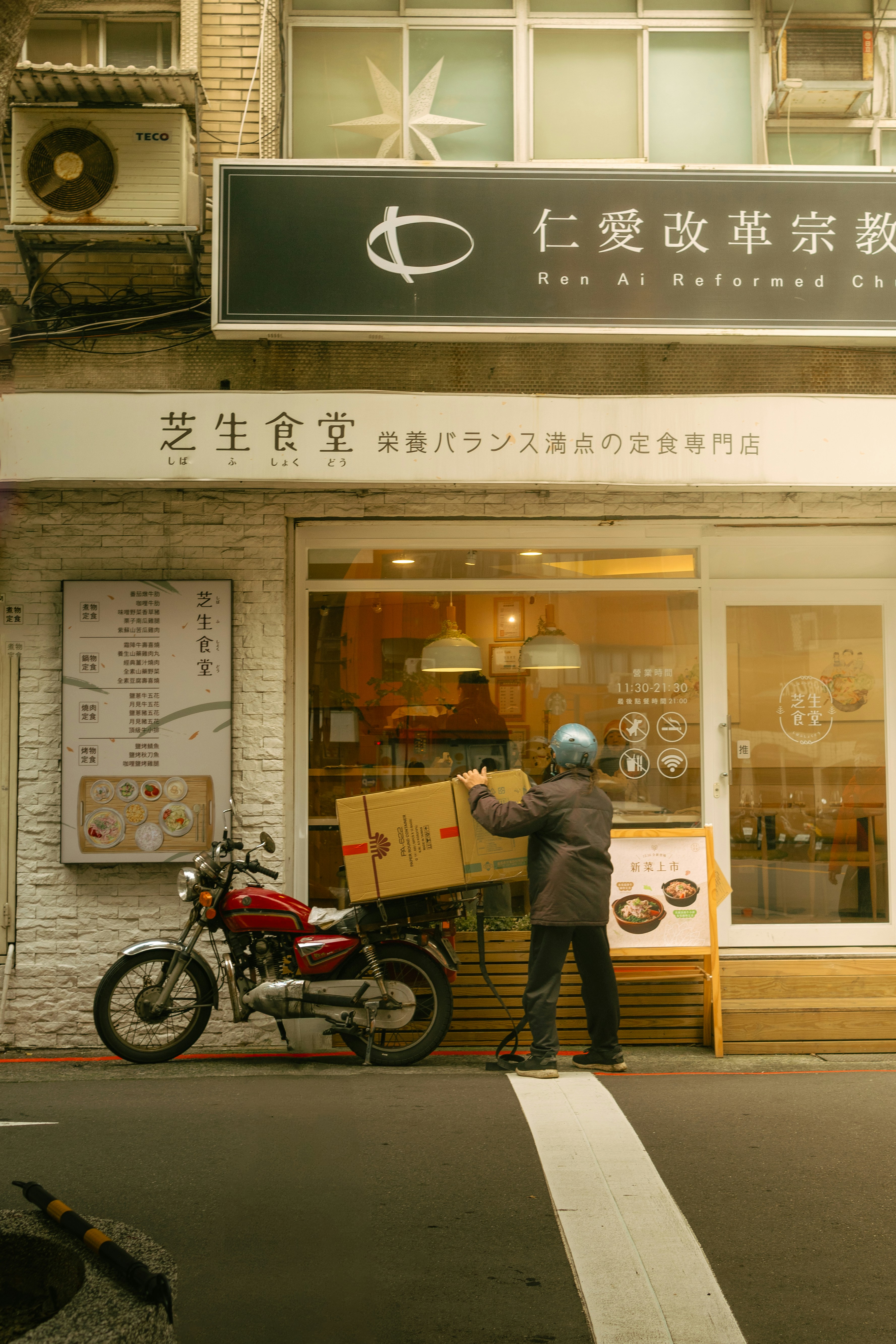 Parcel in Transit at a Sunlit Eatery Facade