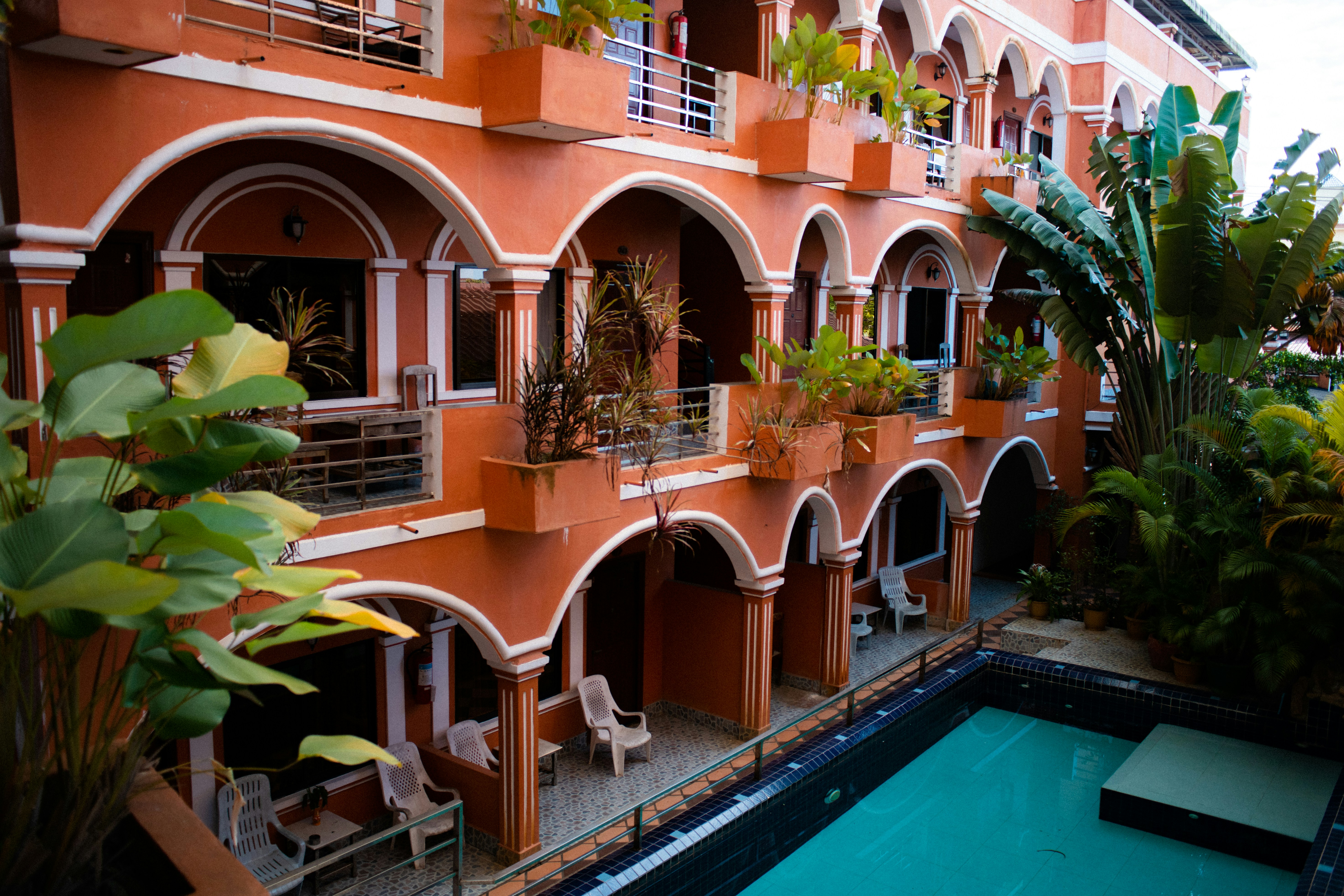 Terracotta Arcades Framing a Poolside Oasis
