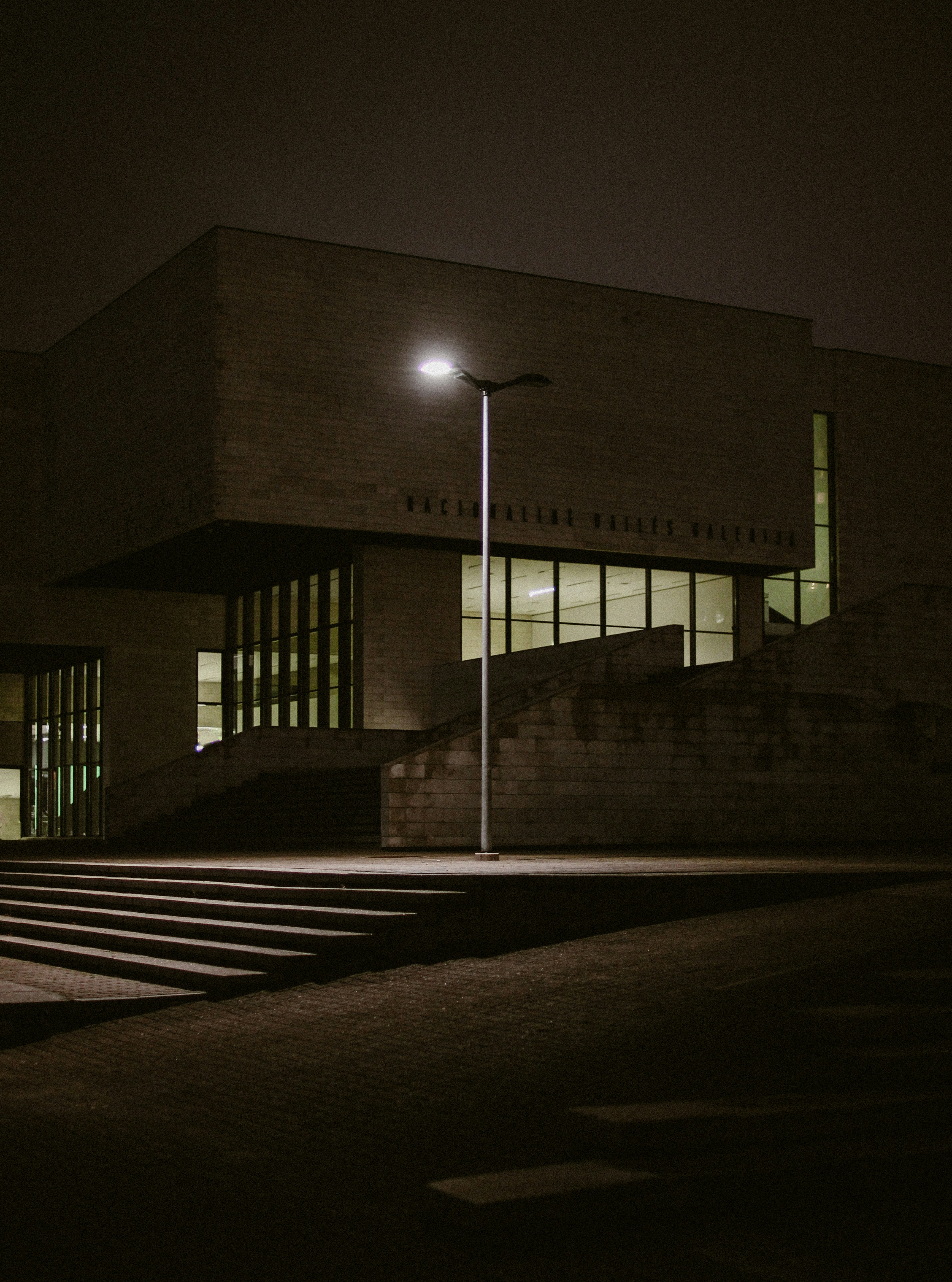 Midnight Lantern on a Quiet Modern Facade