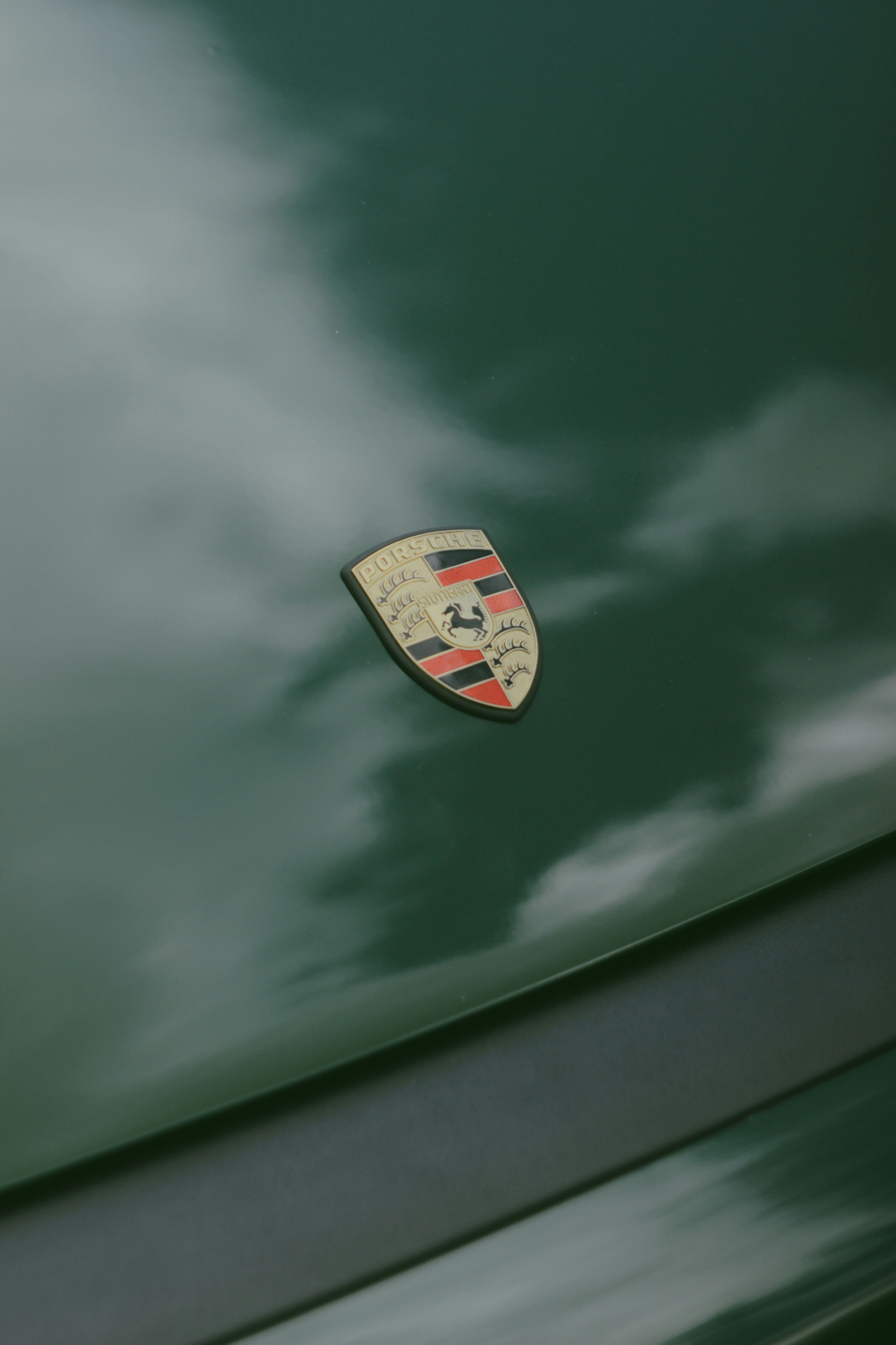 Emerald Hood, Porsche Crest: A Quiet Reflective Moment