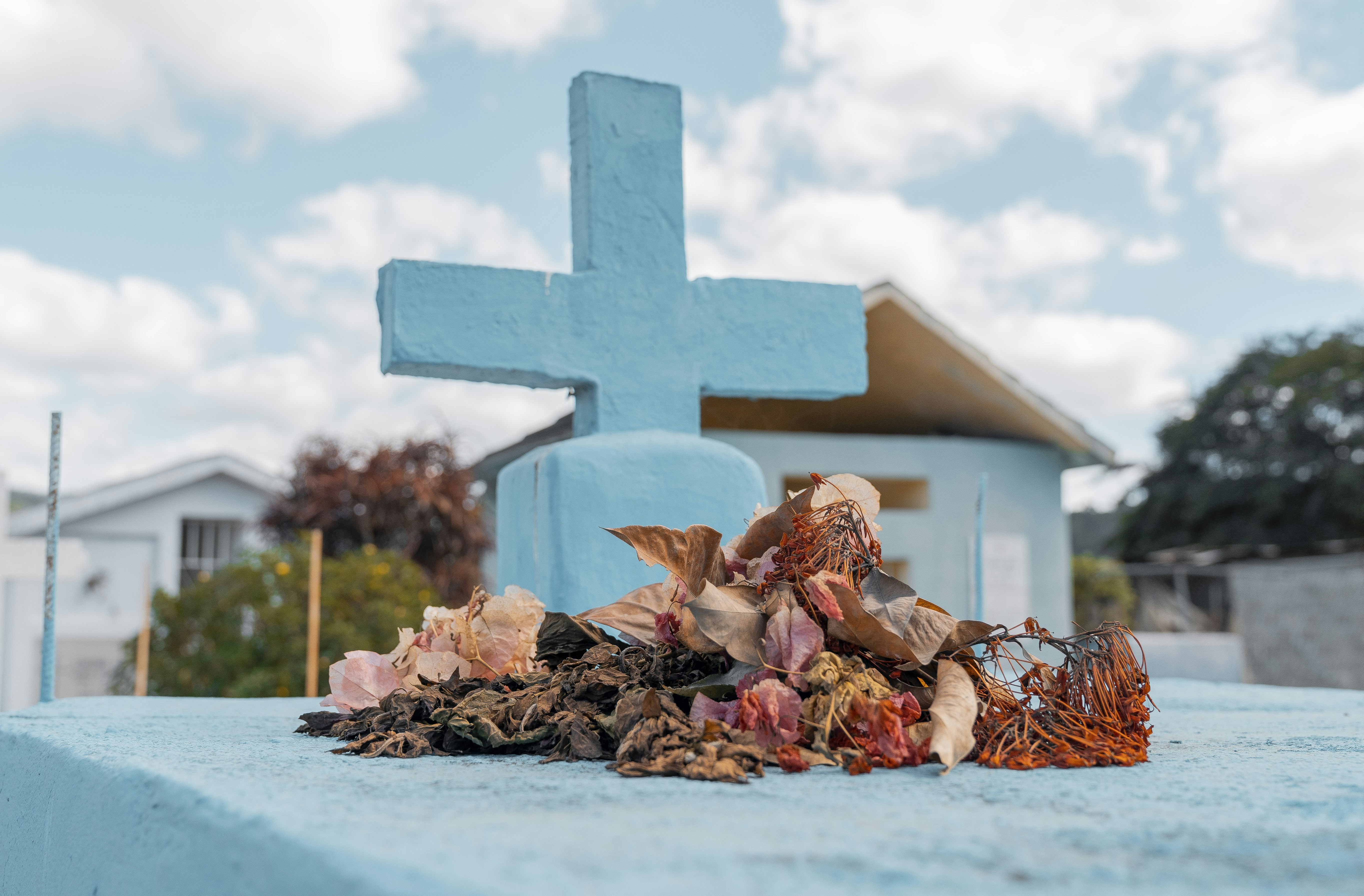 Blue Grave: A Quiet Cross and Autumn Remnants