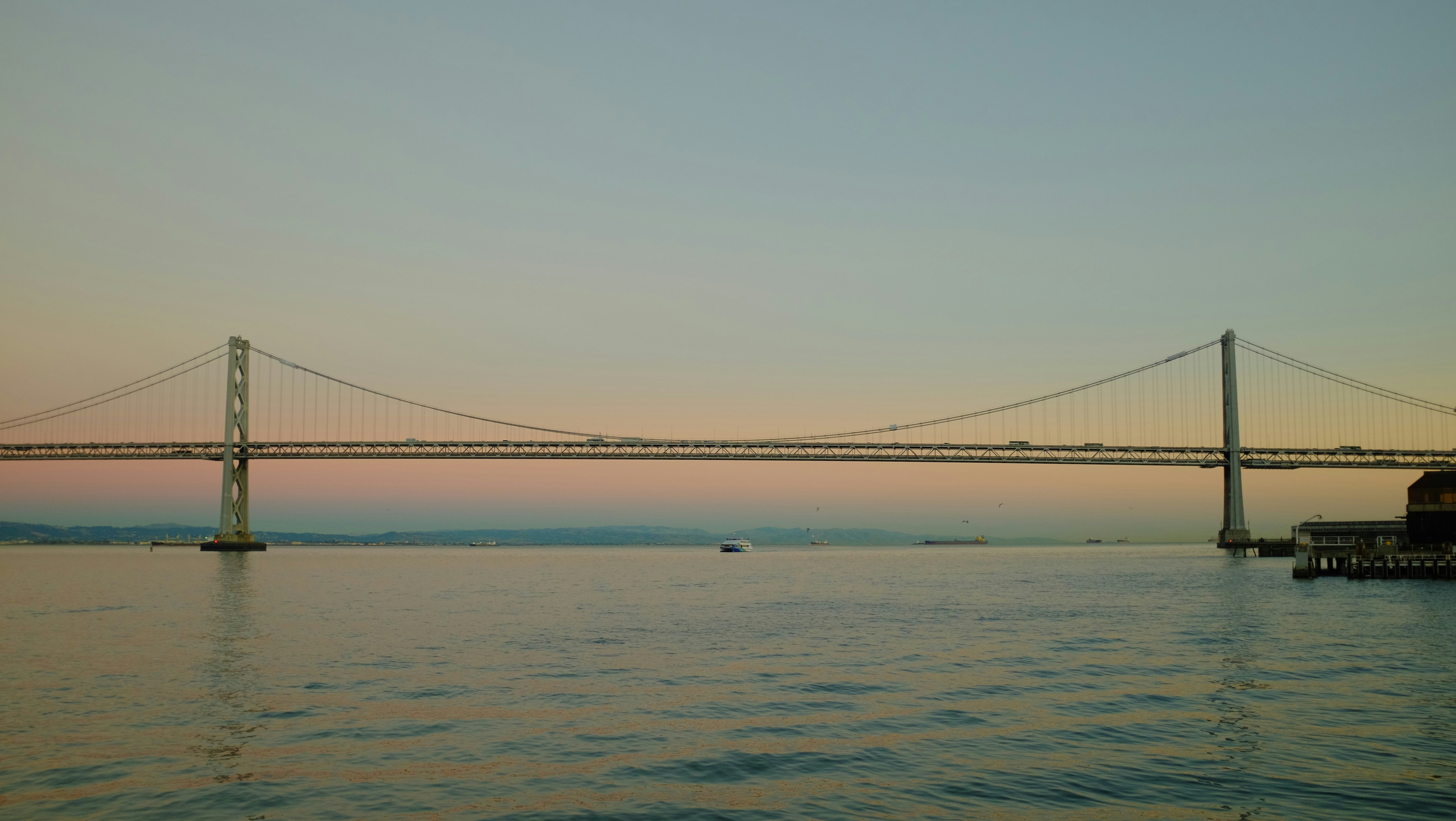 A large bridge spanning over a large body of water photo – Free Bridge ...