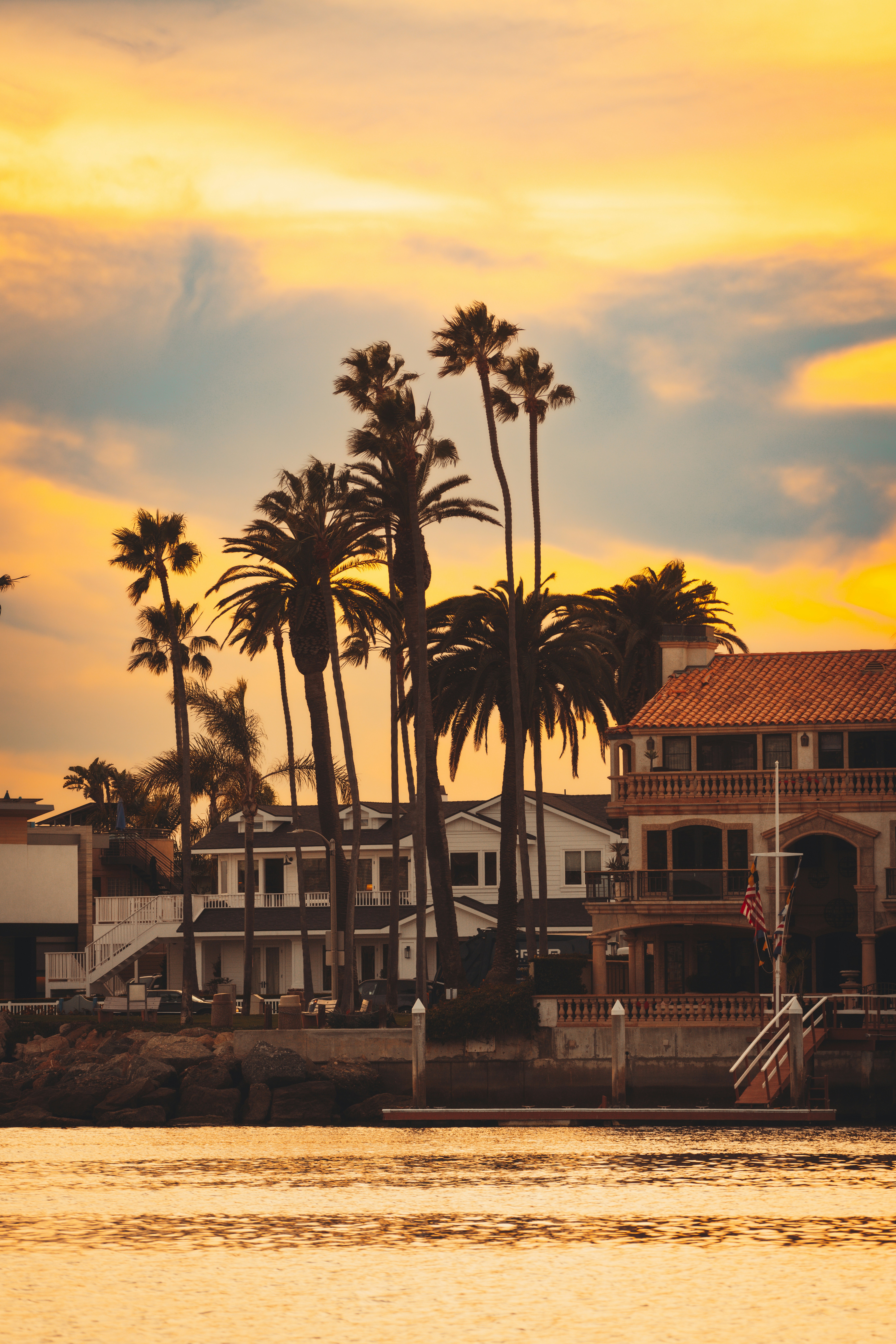 Dusk Over Palm-Topped Waterfront: Quiet Coastal Mansions