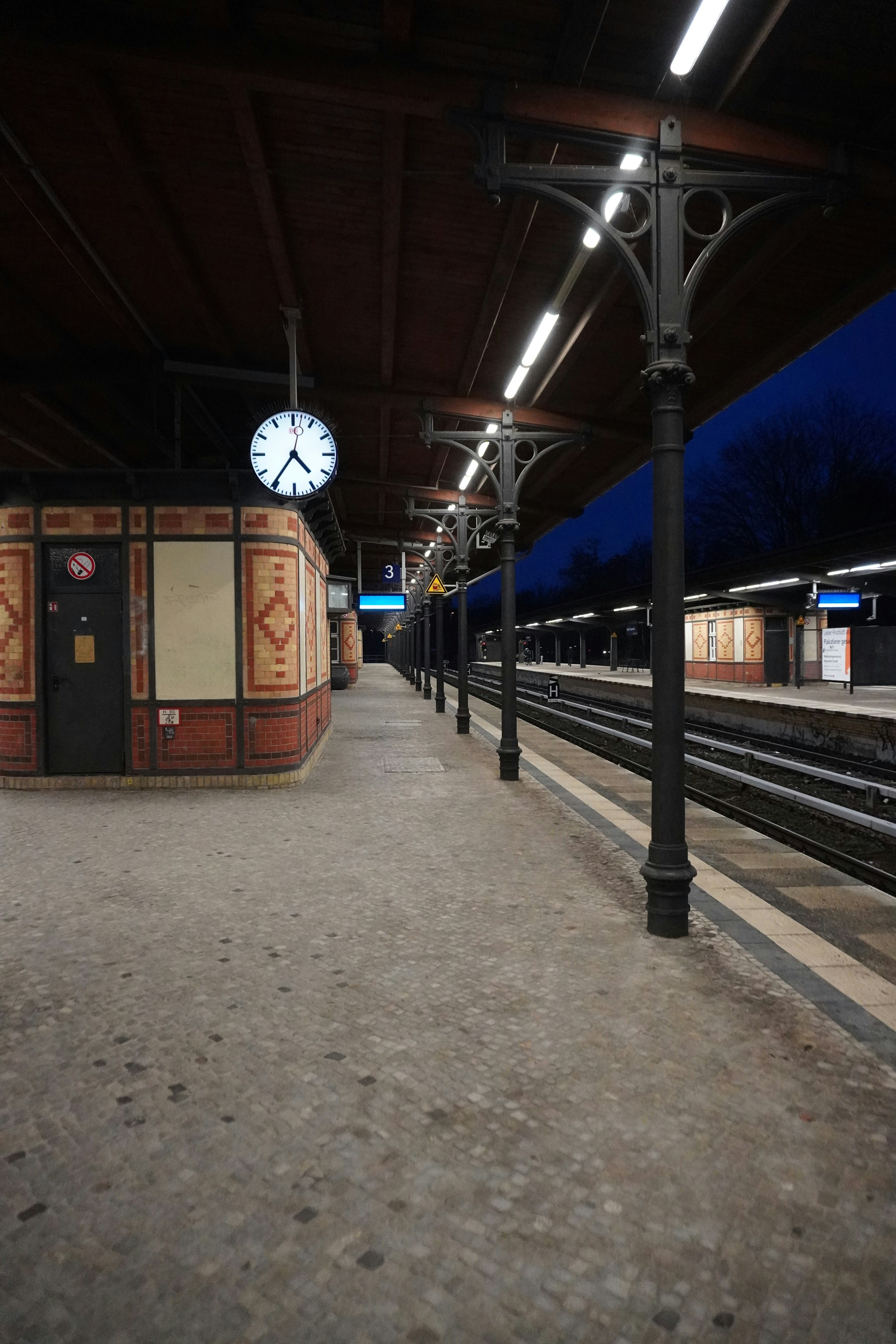 Midnight Platform: Clock, Columns, and Quiet Rails