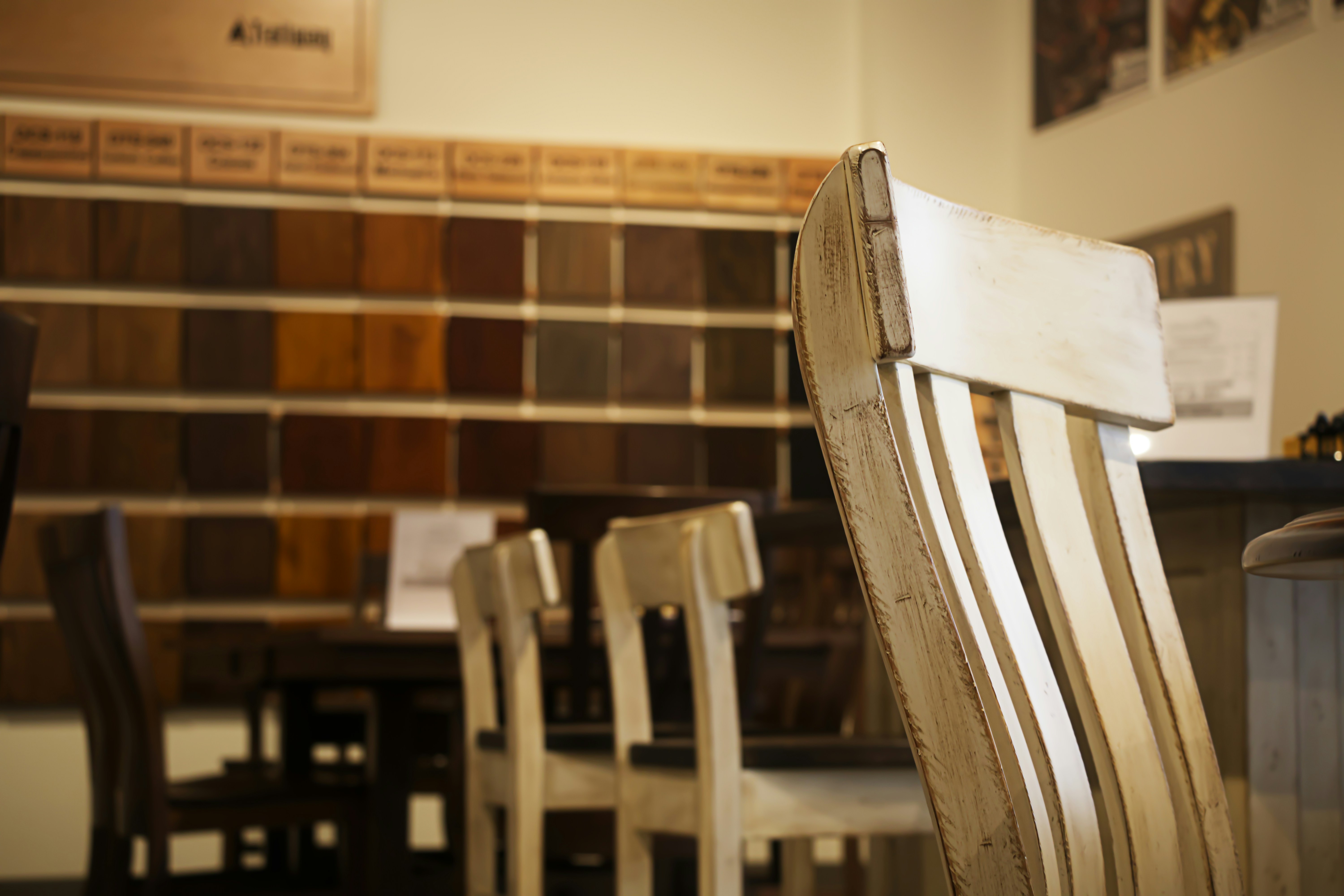 Contours of Quiet Craft: Foreground Chair Against a Wall of Wood Grains