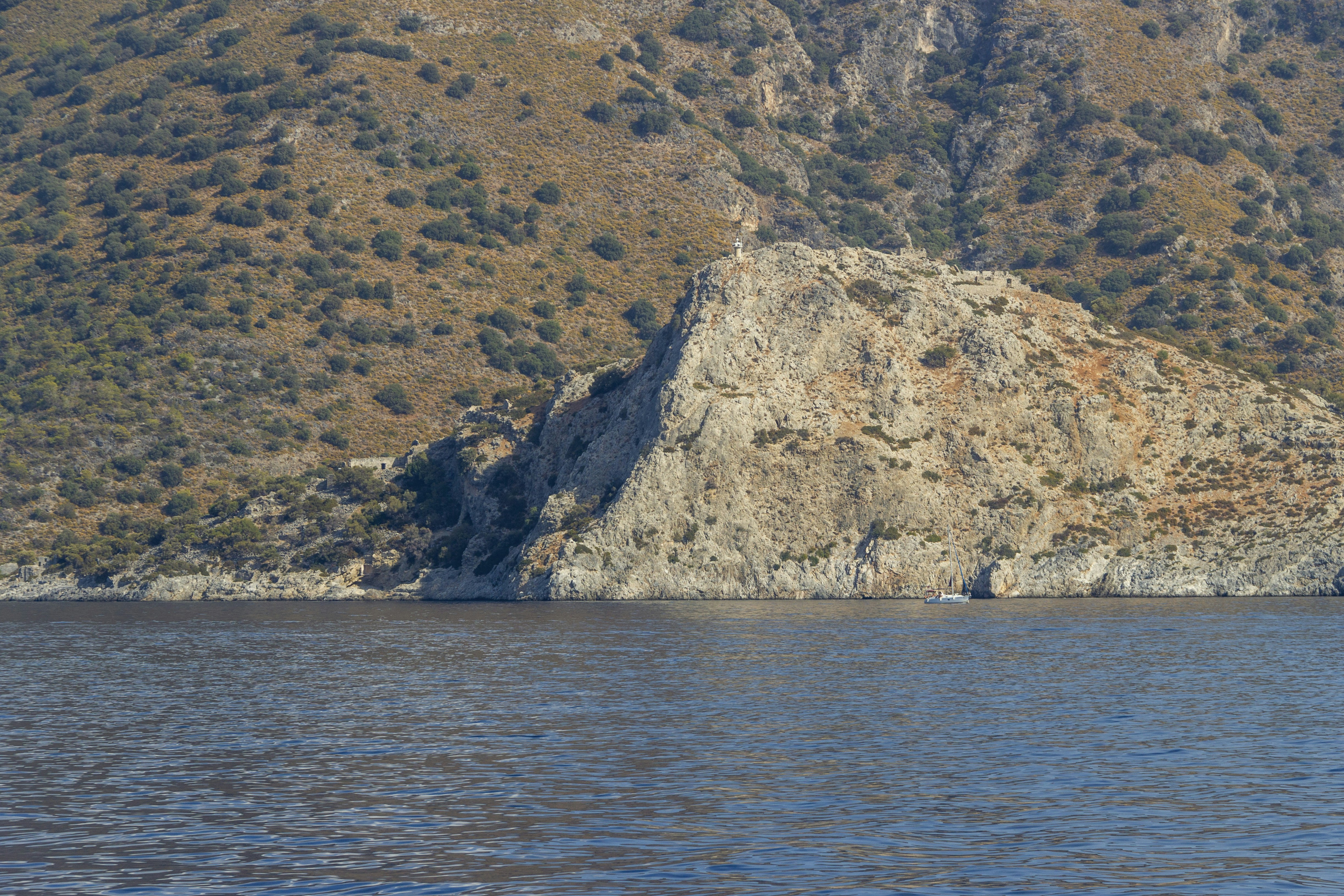 Promontory of Quiet Power: Limestone Cliff Over a Glassy Sea