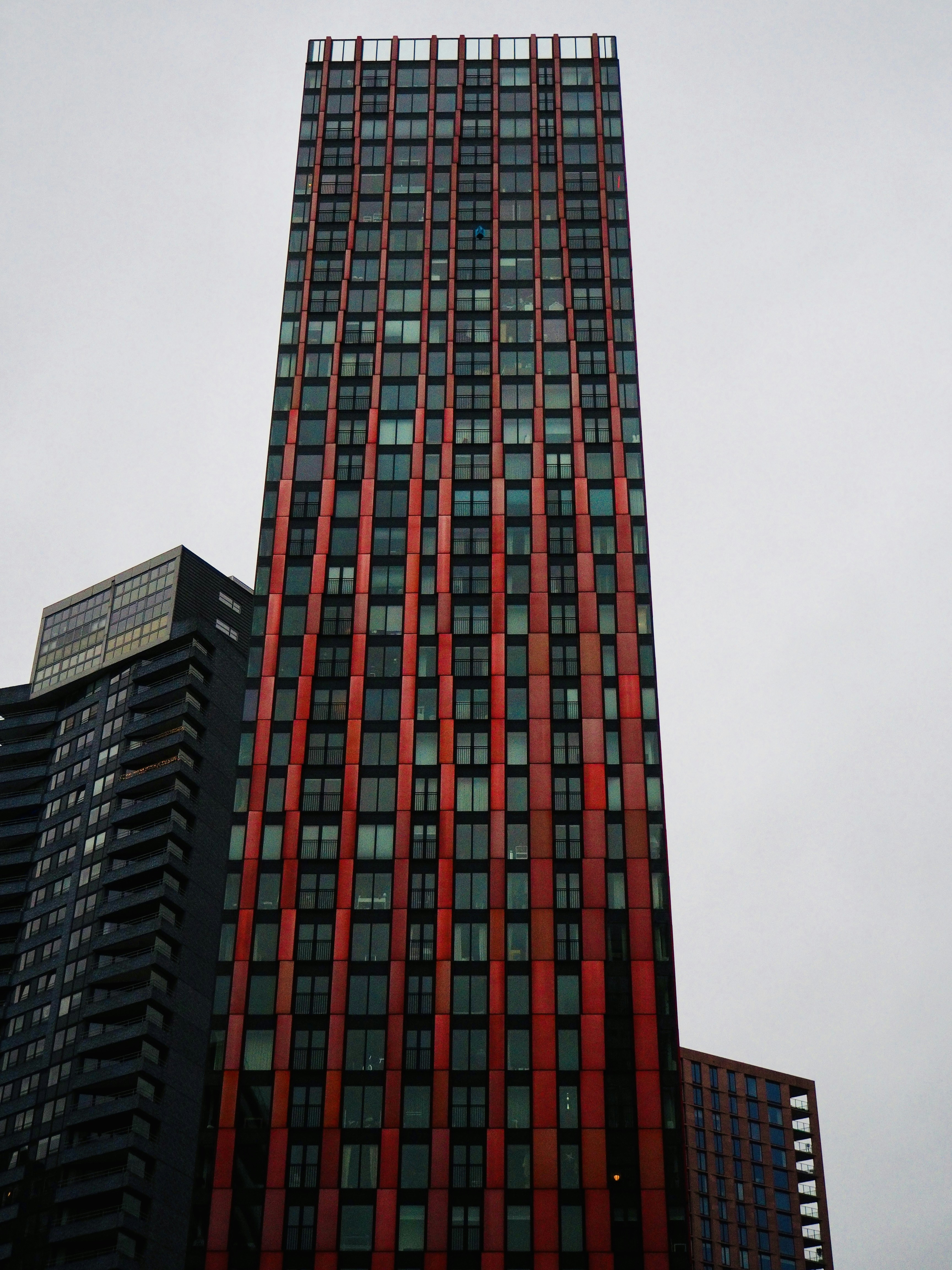 A very tall building with a lot of windows photo – Free City Image on ...