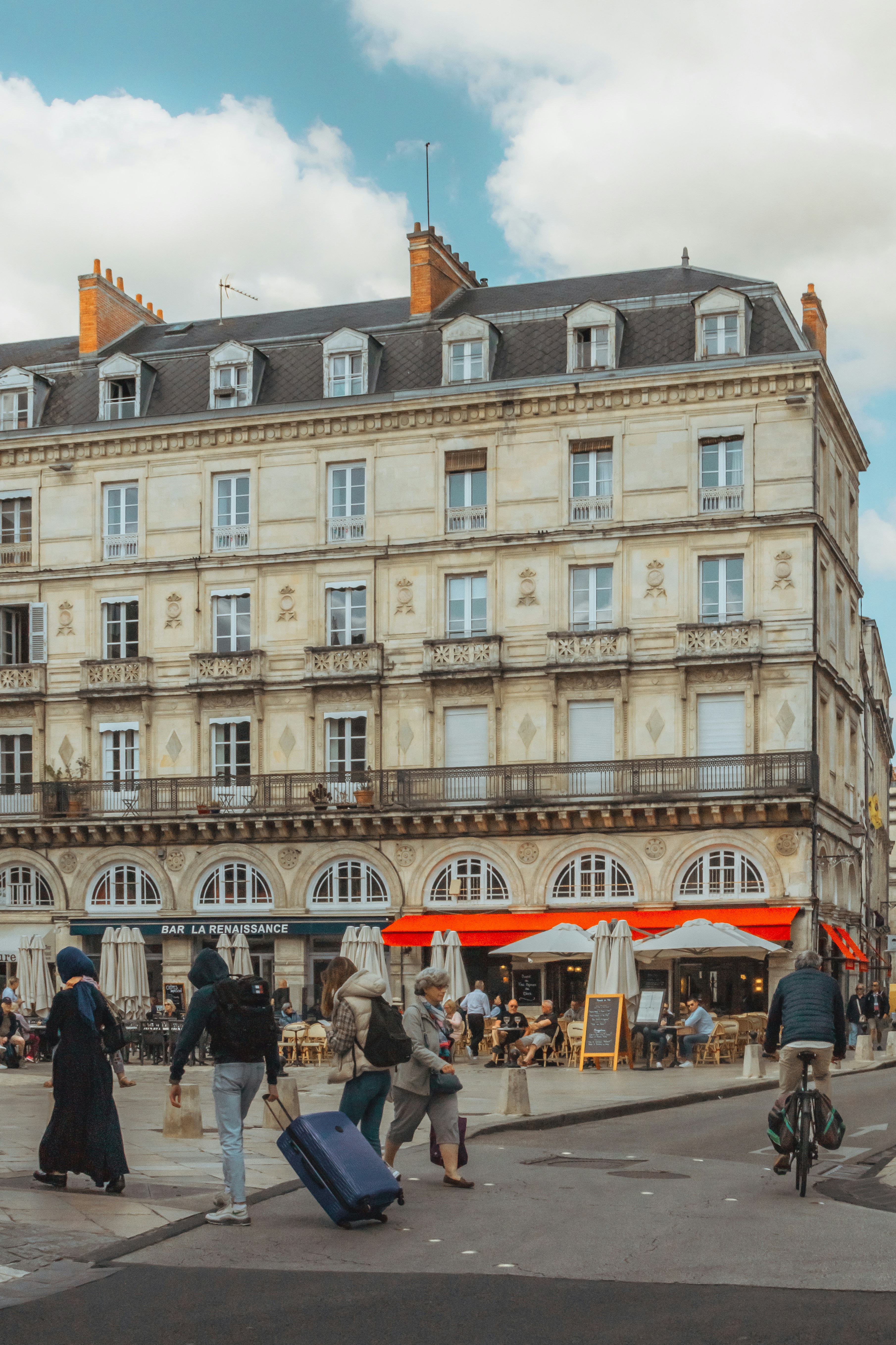 Haussmannian Street Pulse: Coral Café Awnings and Moving Moments