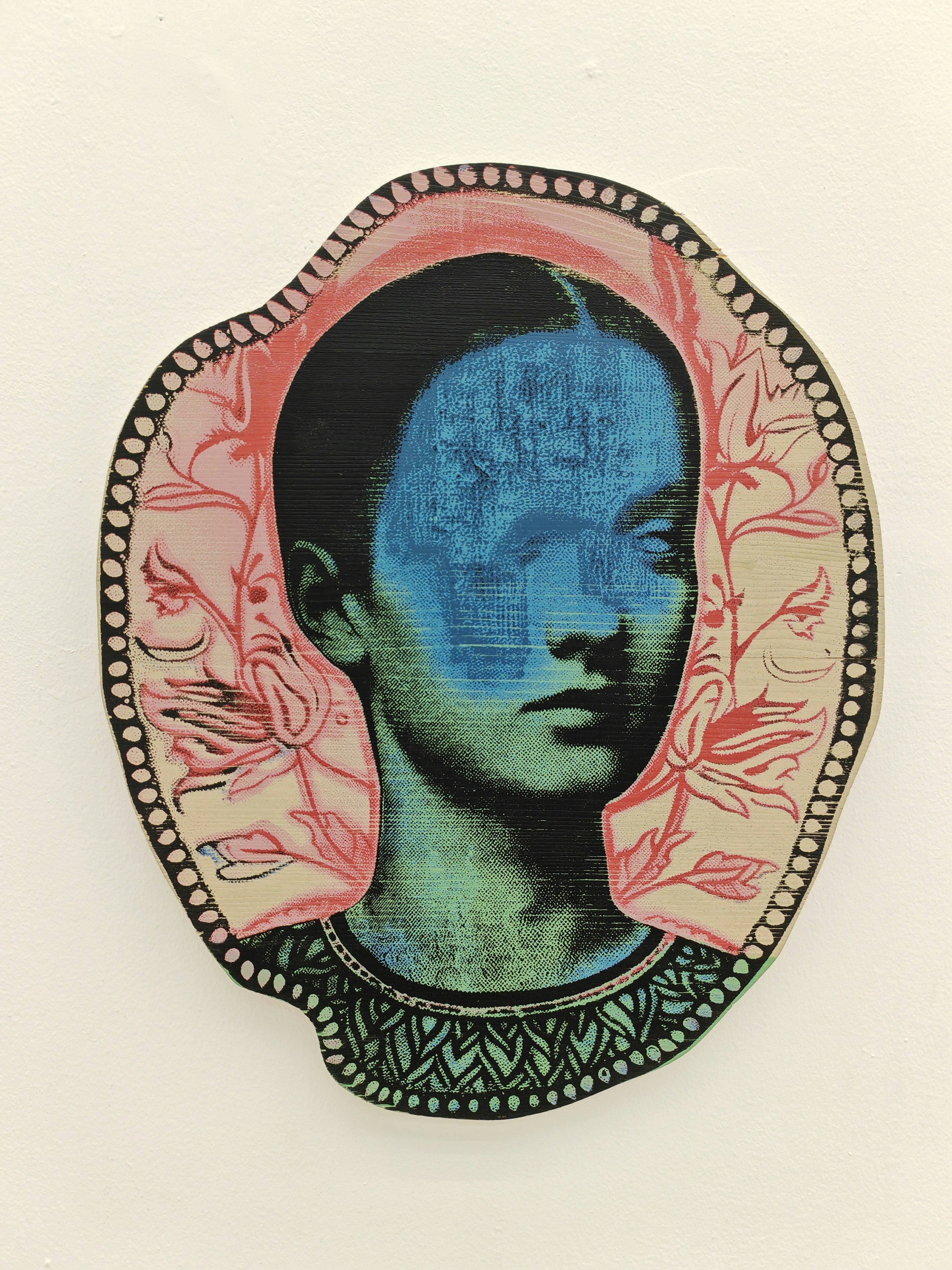 A stylized female bust portrait on a decorative cut-out, with blue-green skin tones and a pink floral background; a mixed-media artwork emphasizing texture and color contrast.