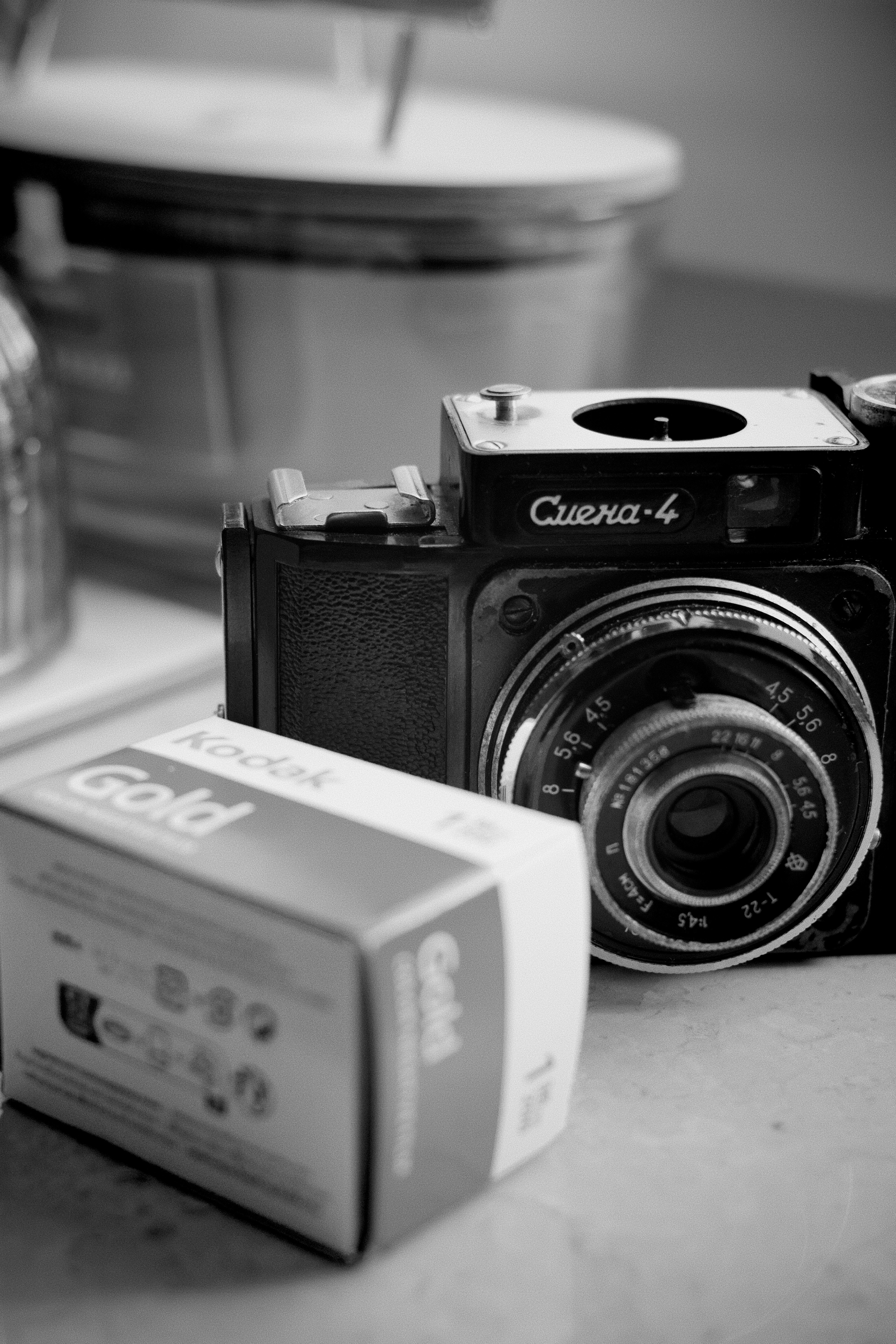 Smena-4 and Kodak Gold: A monochrome still-life of vintage photography gear