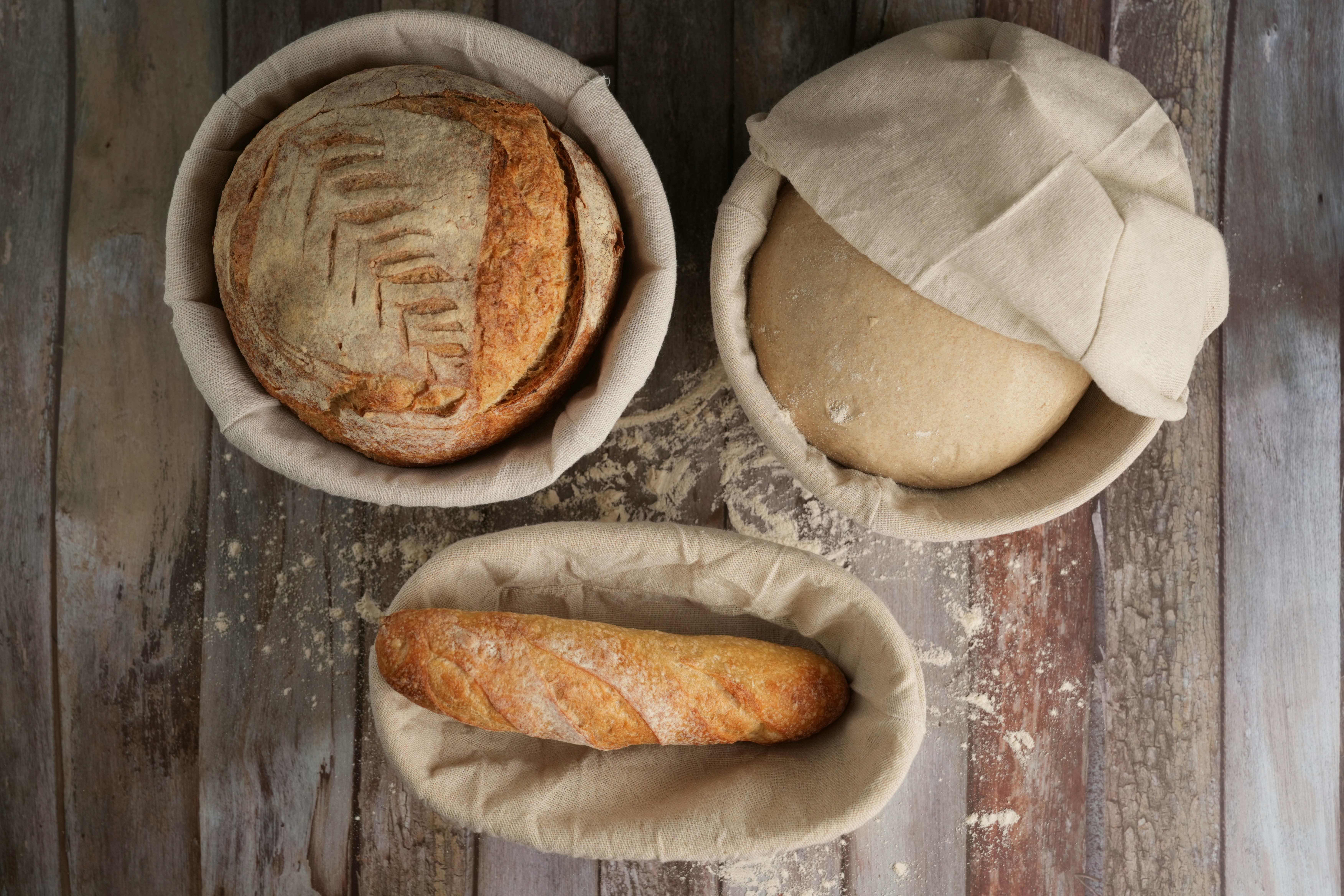 A table topped with bread and a loaf of bread photo – Free Food Image ...