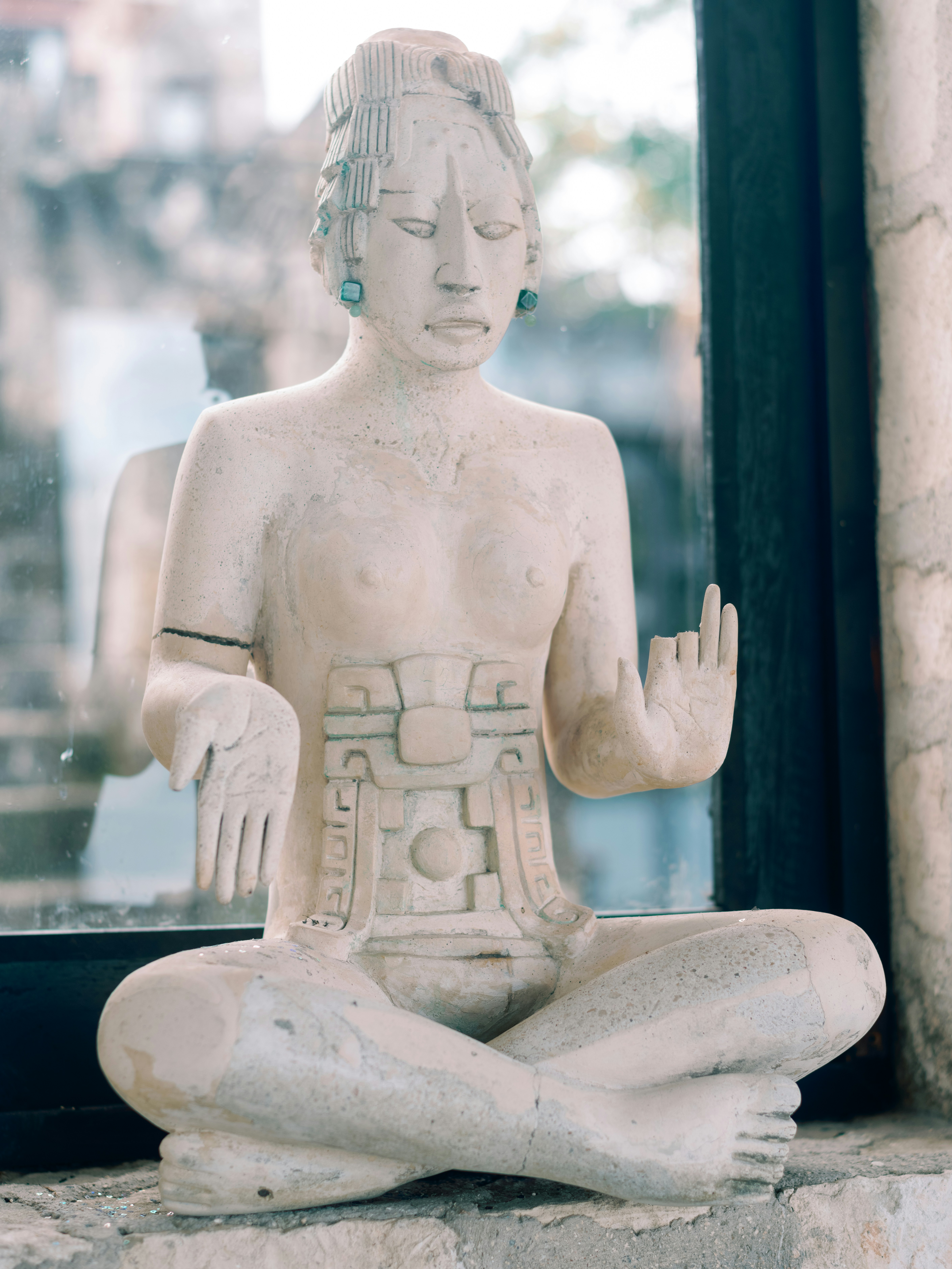 Stone-Seated Meditator in Quiet Window Light