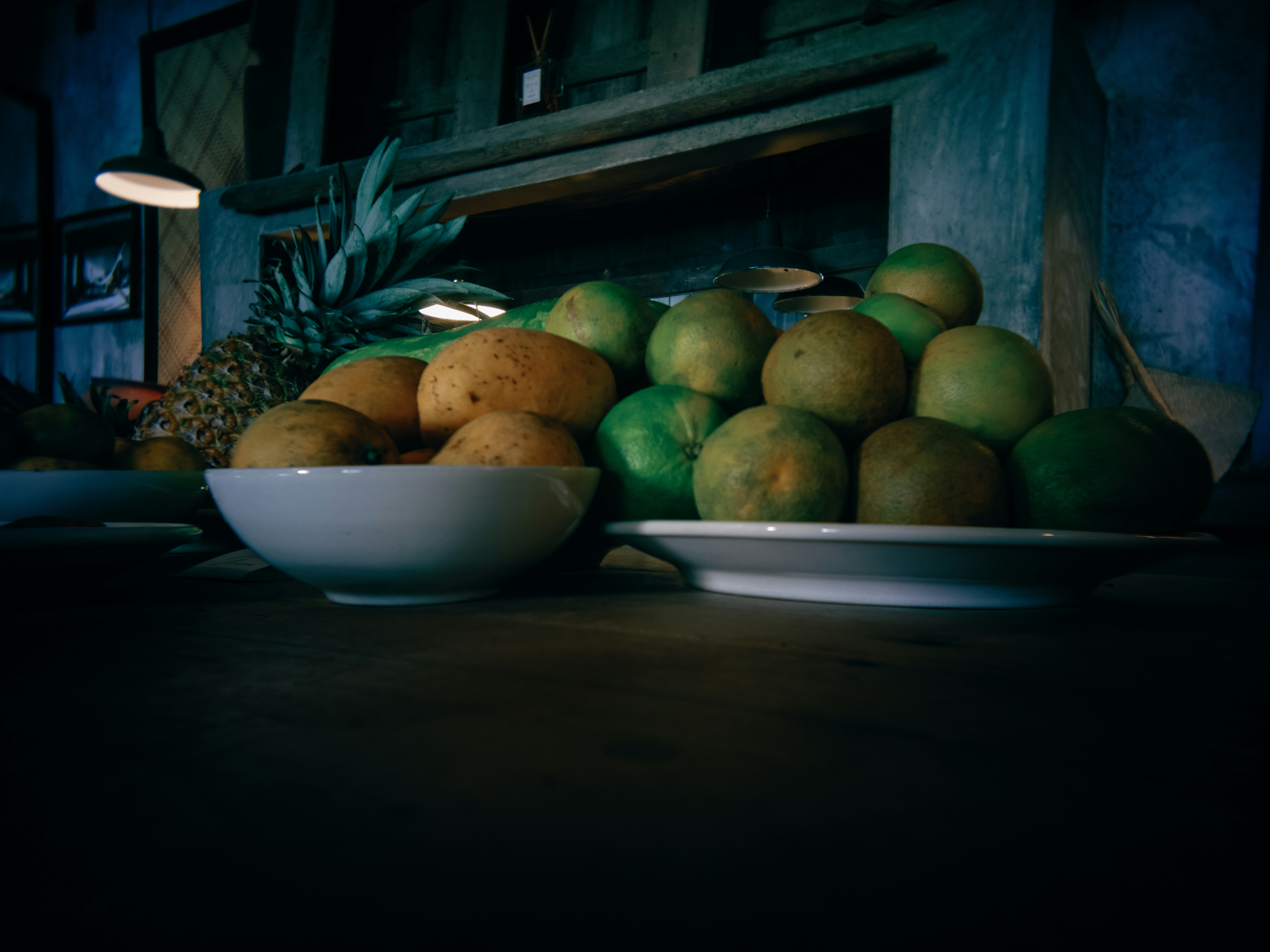Moonlit Tropics: Pineapple and Mangoes on a Quiet Table